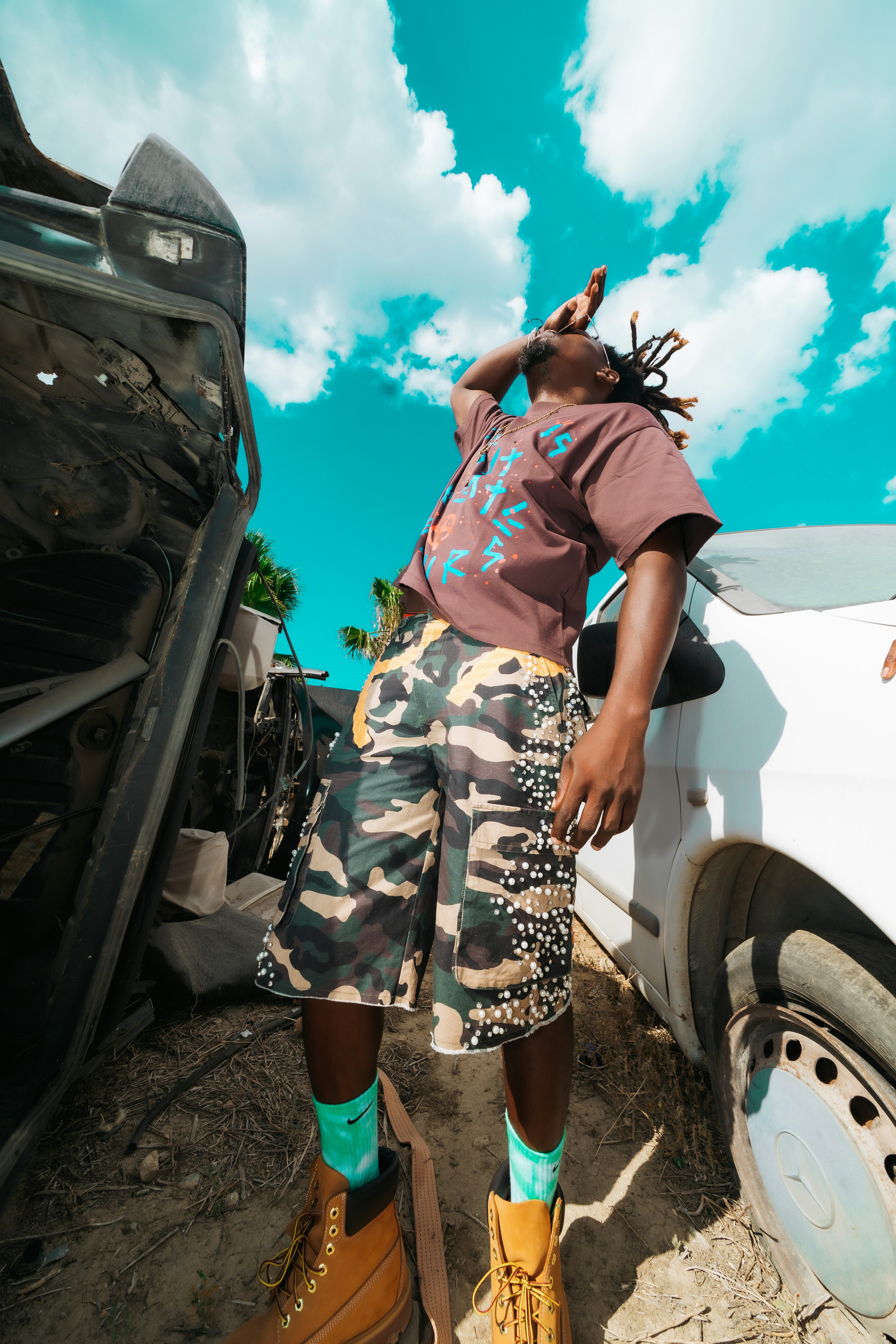 Urban Dreamscape: Neon Outfit, Camouflage Shorts and Bright Boots