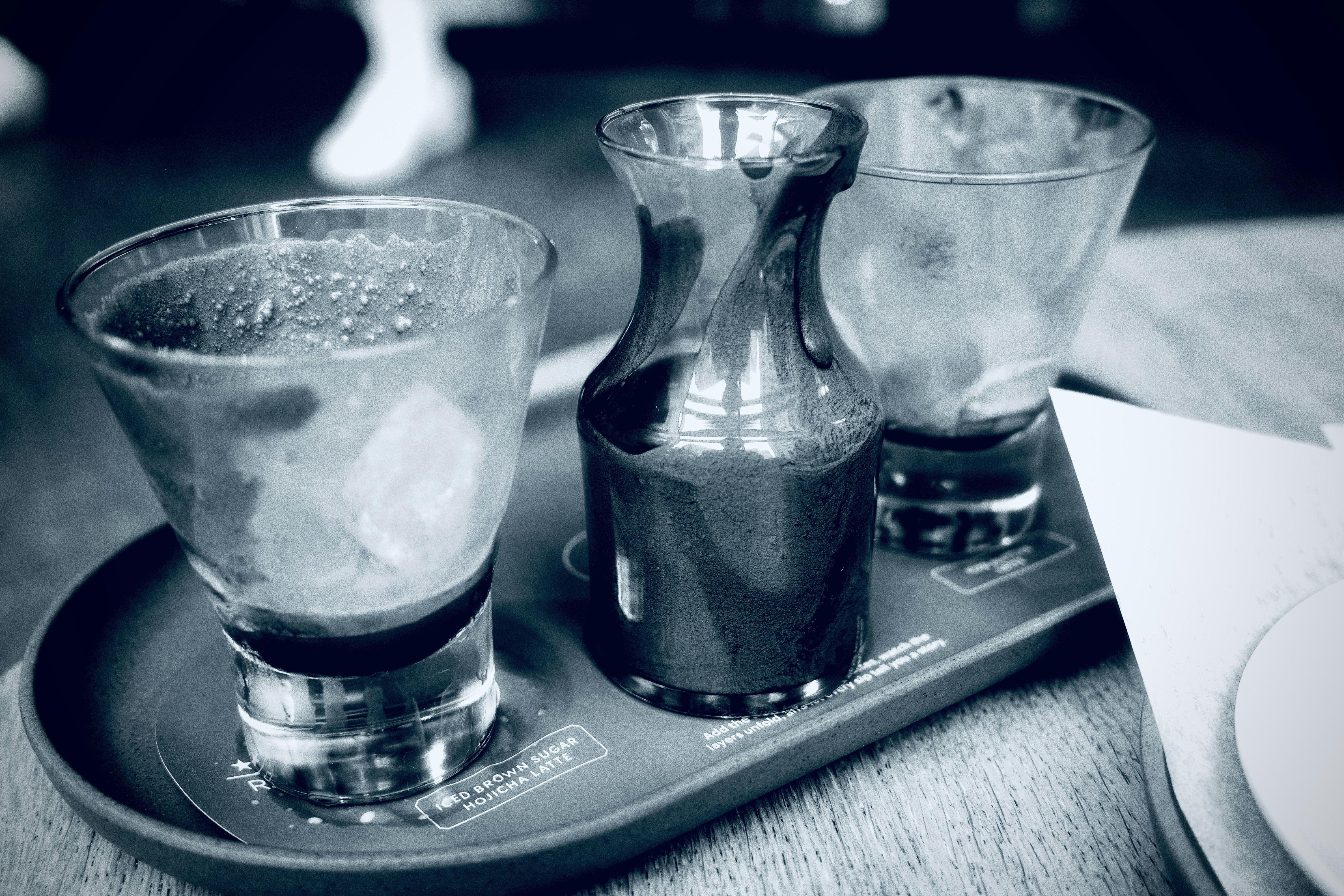 Glassed trio on a tasting tray: quiet ritual of coffee service