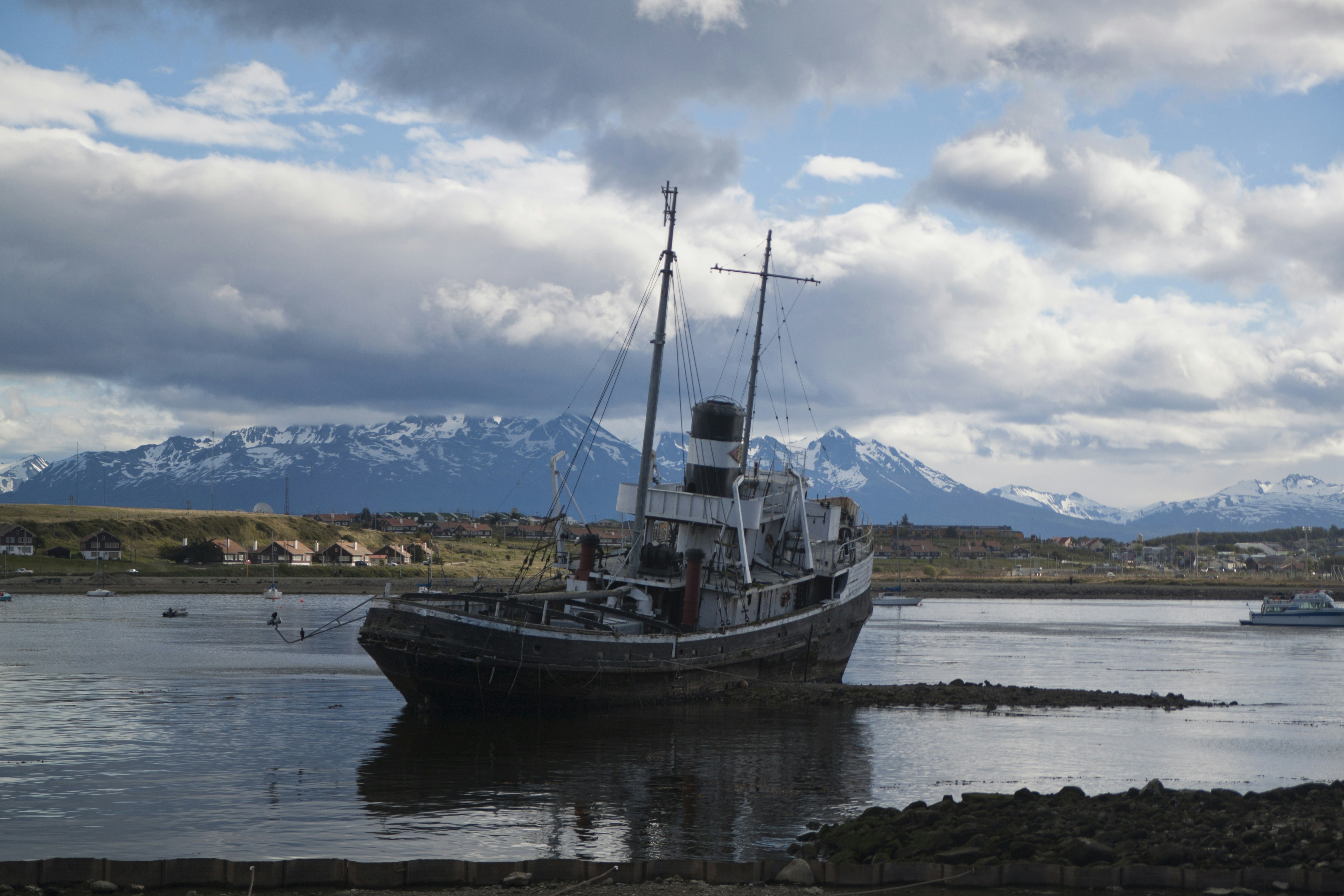 The Reluctant Vessel at Rest by Snow-tinged Peaks