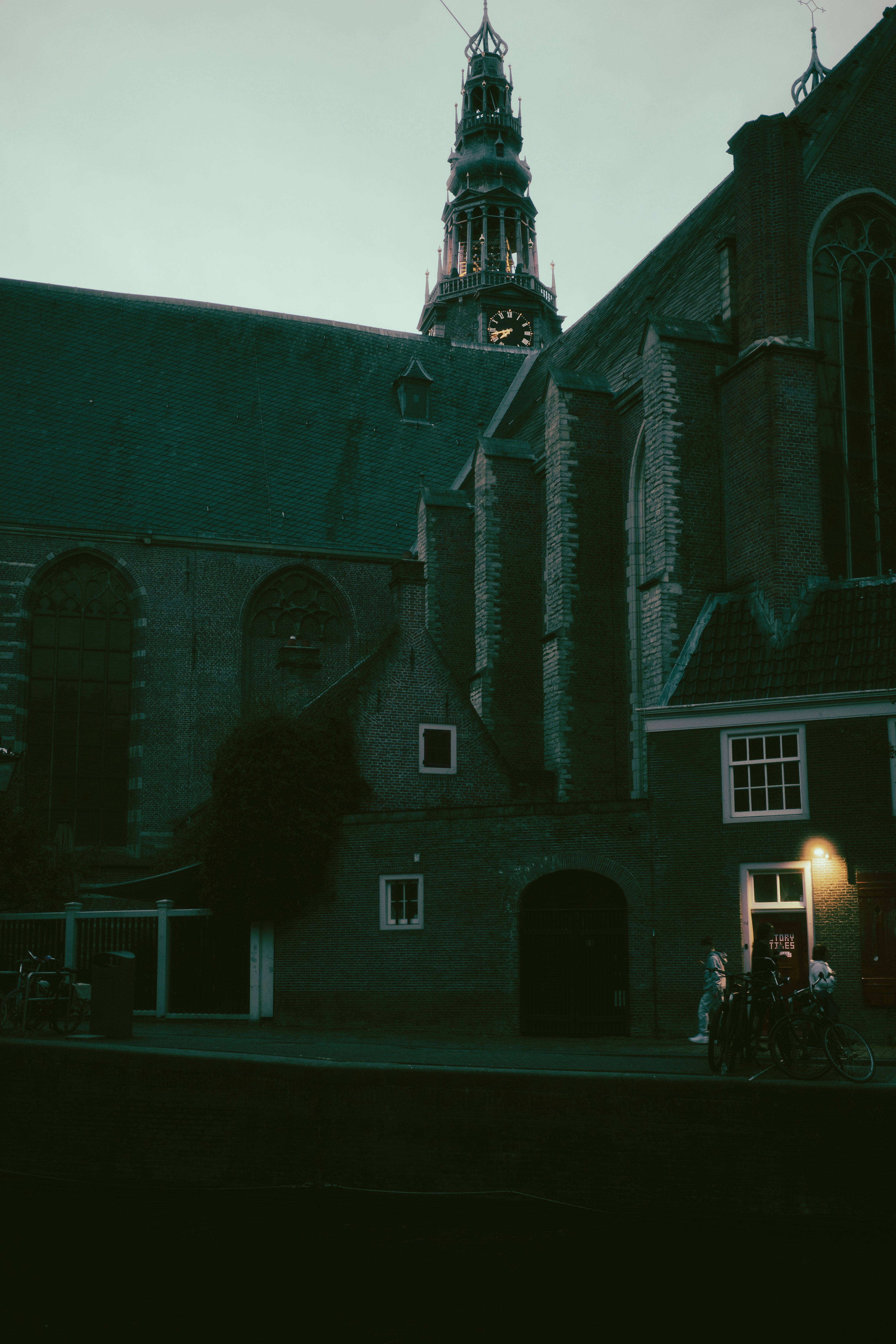 Clock Tower Over Brick Facade at Dusk