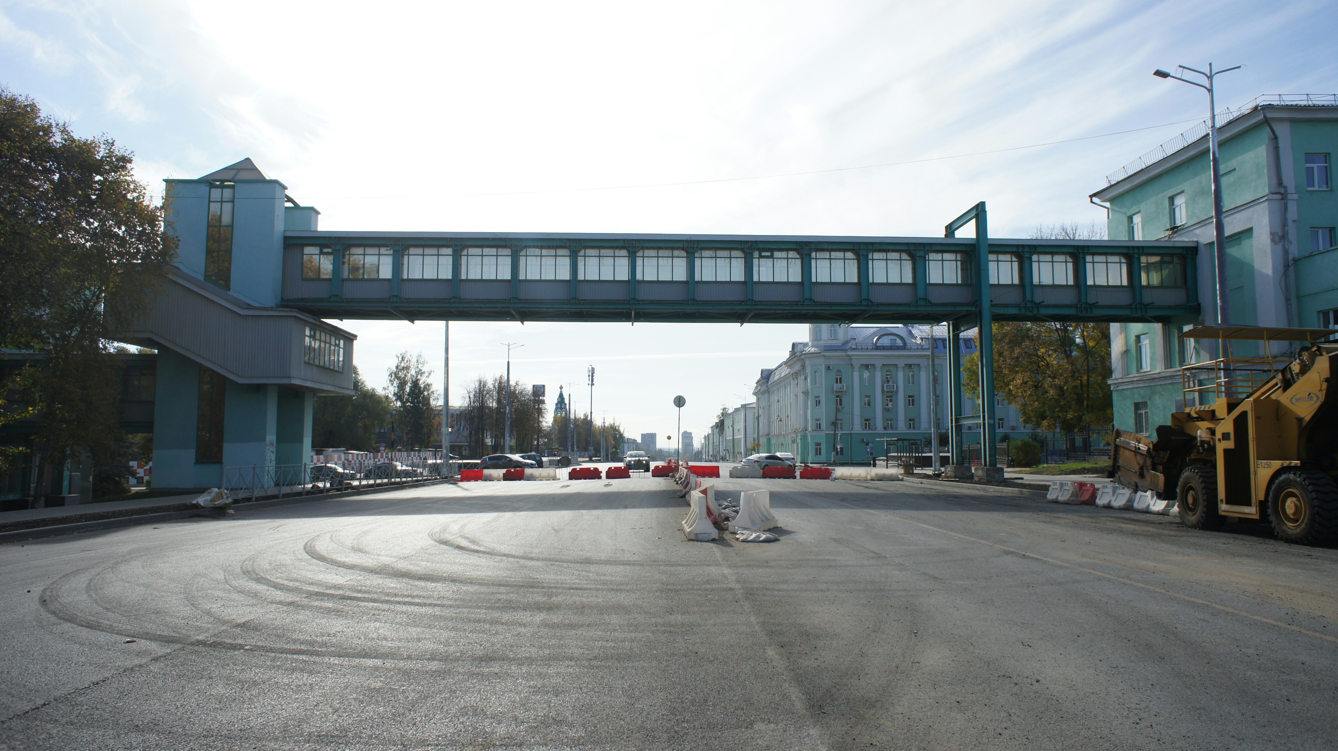 Underpass View: Street Reopens Beneath a Blue Sky Skywalk