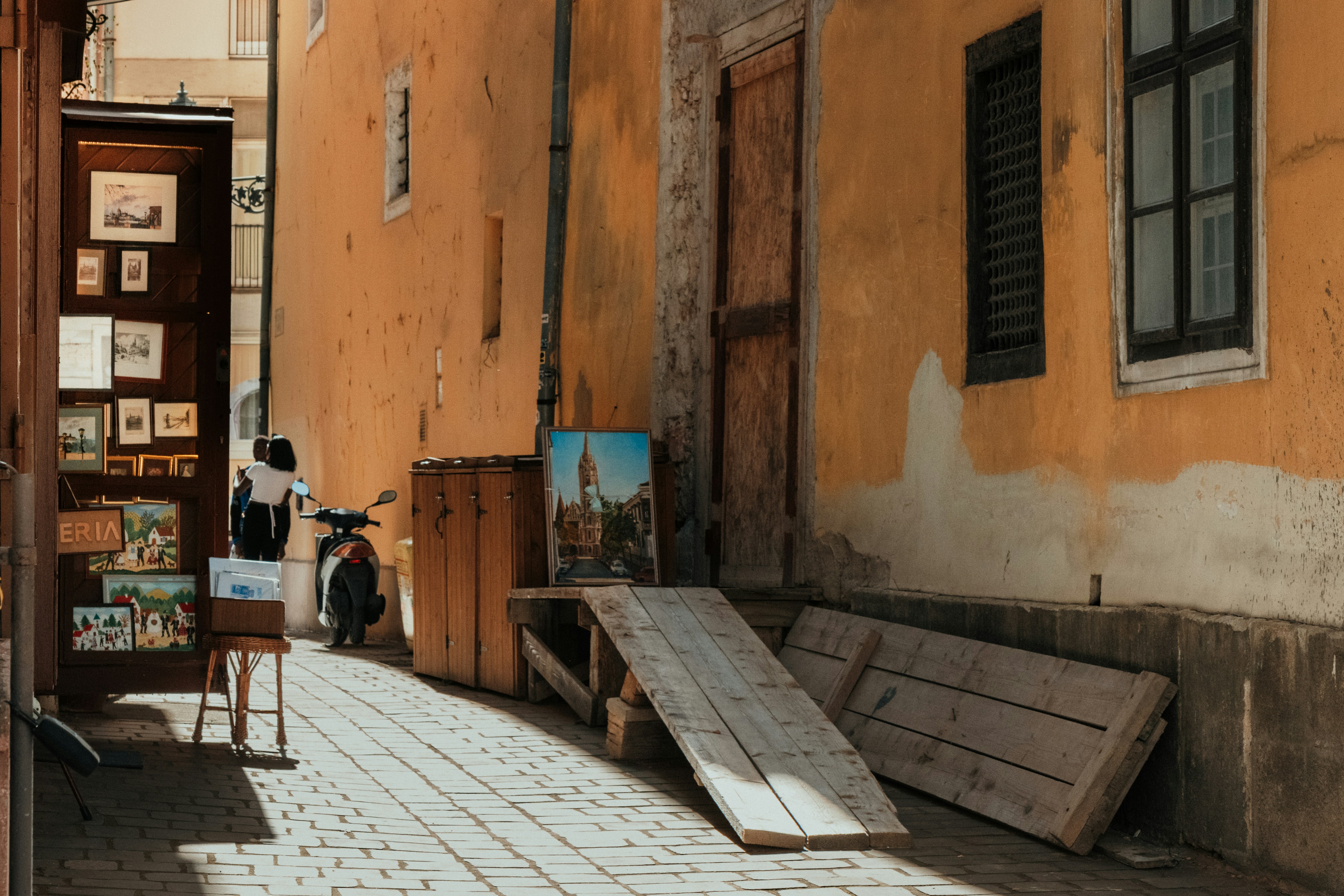 Cobbled Alley Gallery: Light, Wood, and Quiet Street