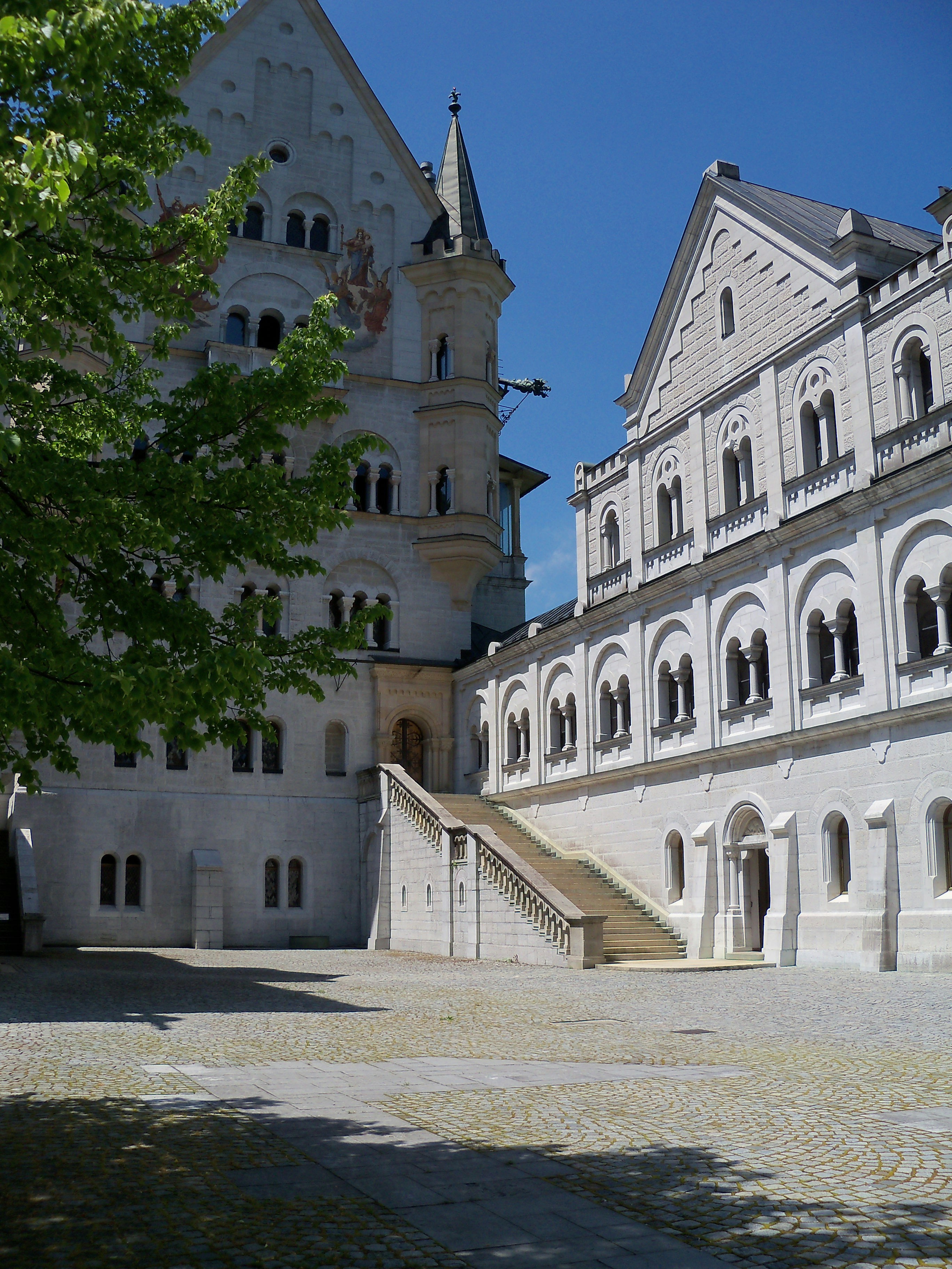 Stone Courtyard Beneath Aisled Towers