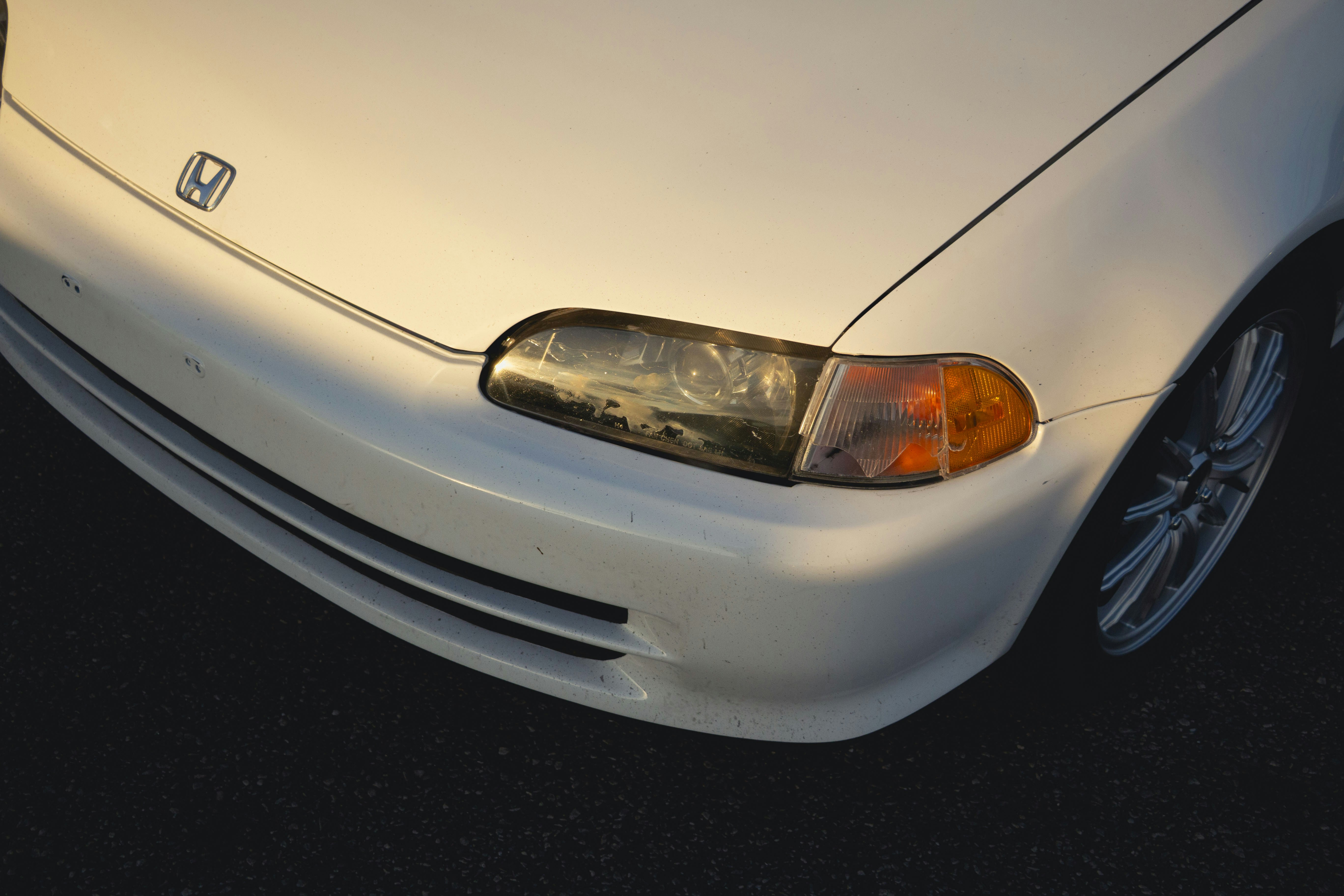 Front-close Portrait of a Weathered Honda with Fender and Headlight Details