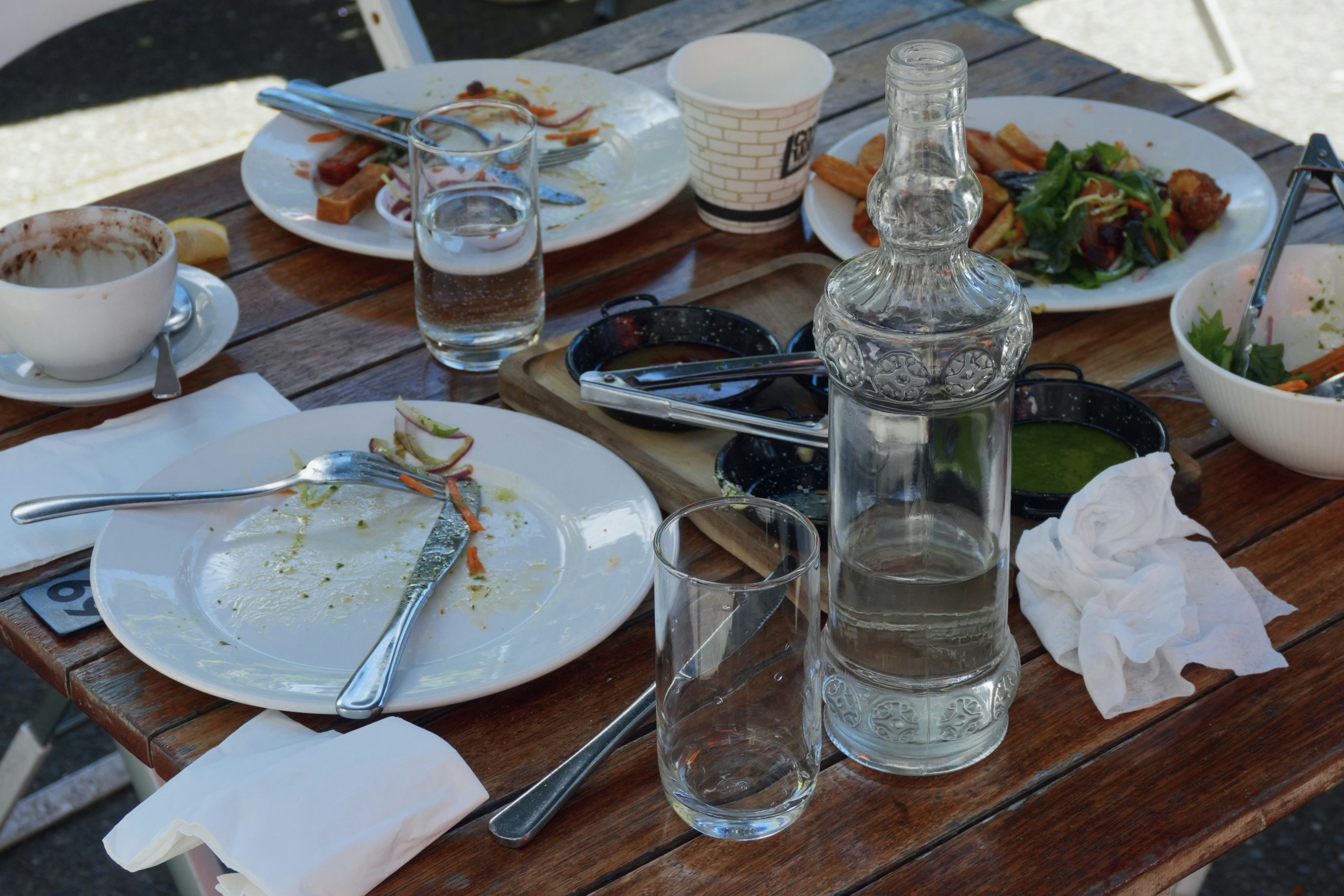 Empty Plate, Shared Table: A Sunlit Meal Tells a Party's Postlude