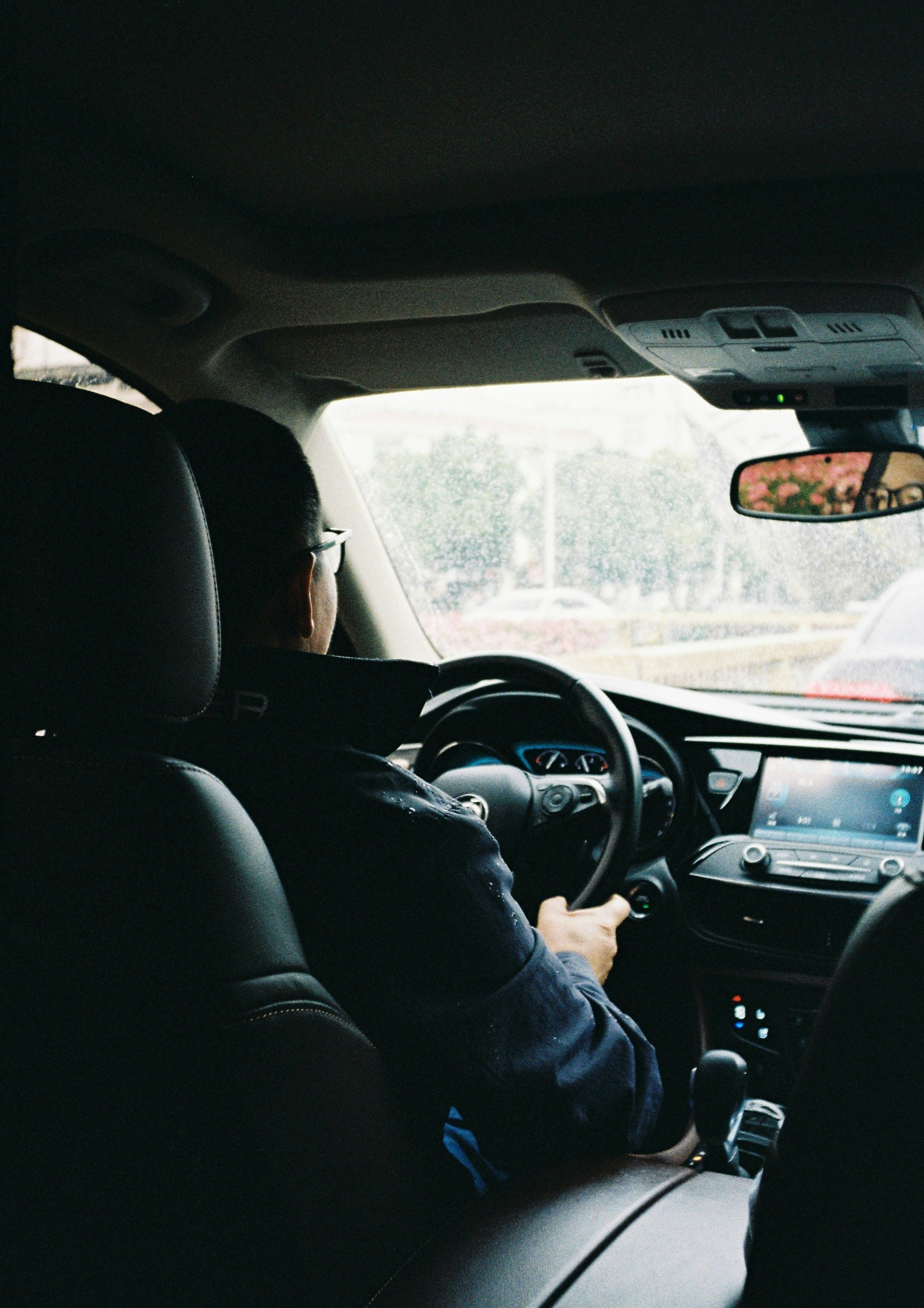 Driver's Perspective: The Road Unfolds in a Quiet Car Cabin
