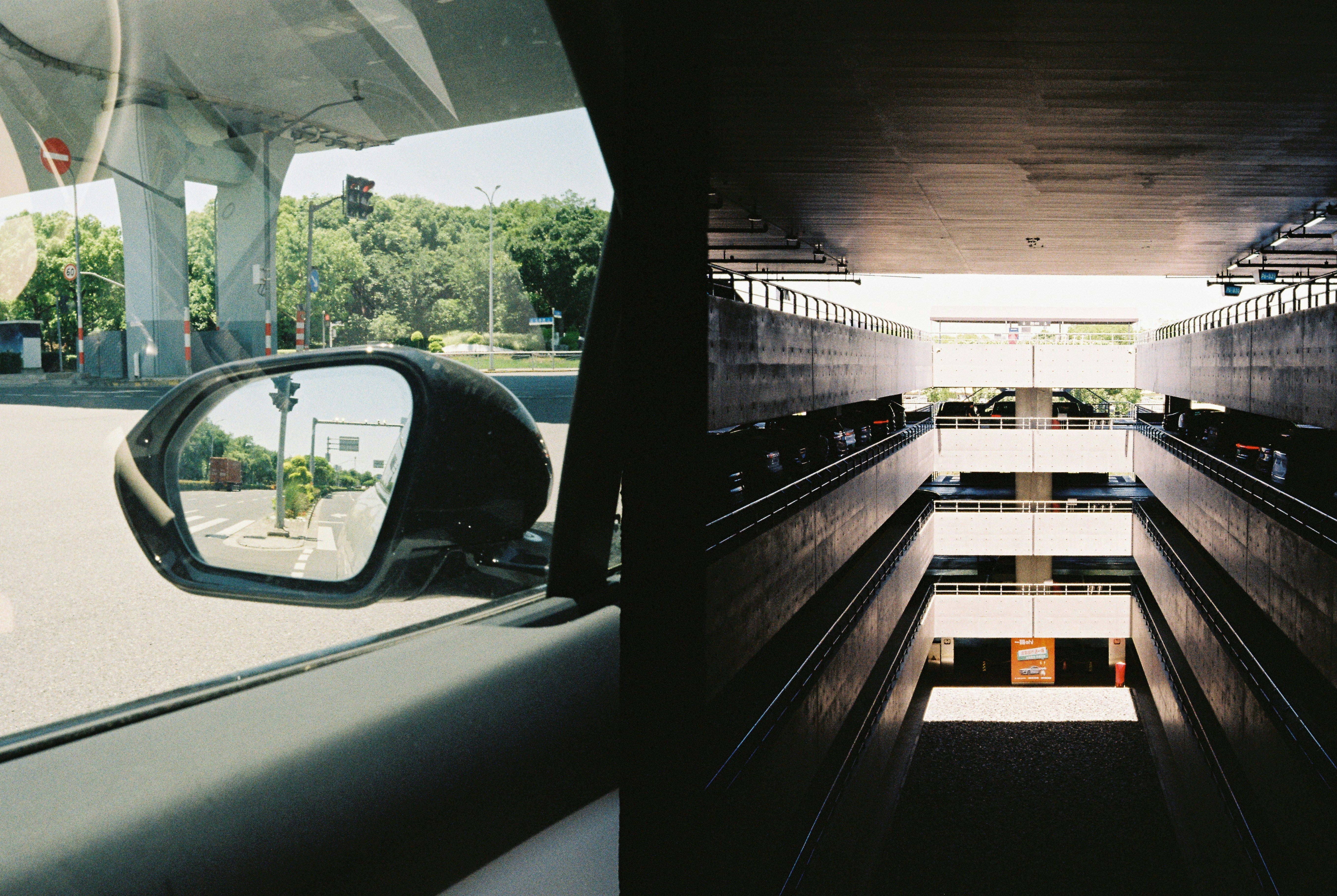 Split View: Car Mirror and Subway Atrium Converge in daylight