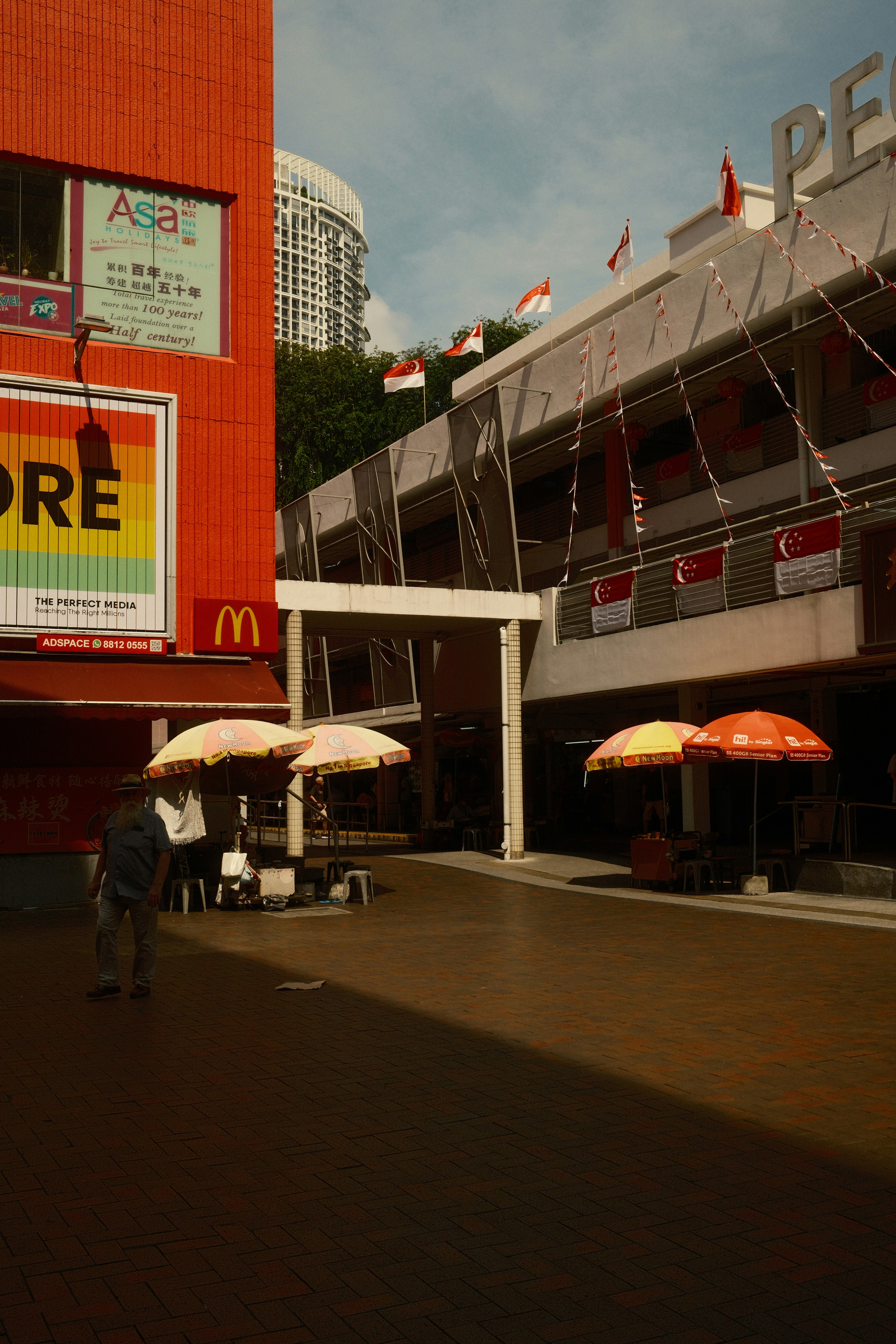 Corner Market Under Neon Signage, Singapore Mall Walkway