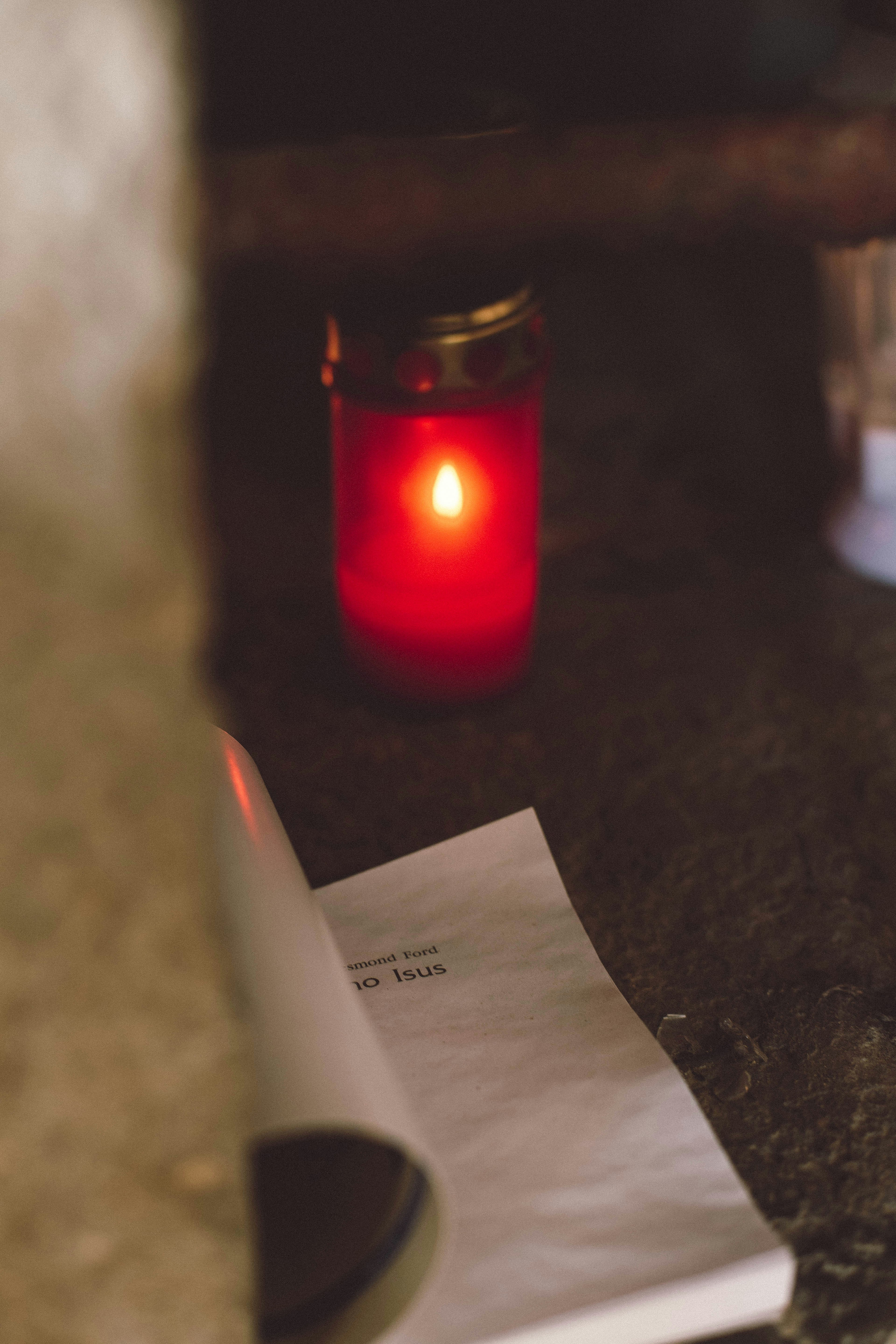 Candlelit Note: A Quiet Moment by a Red Flame
