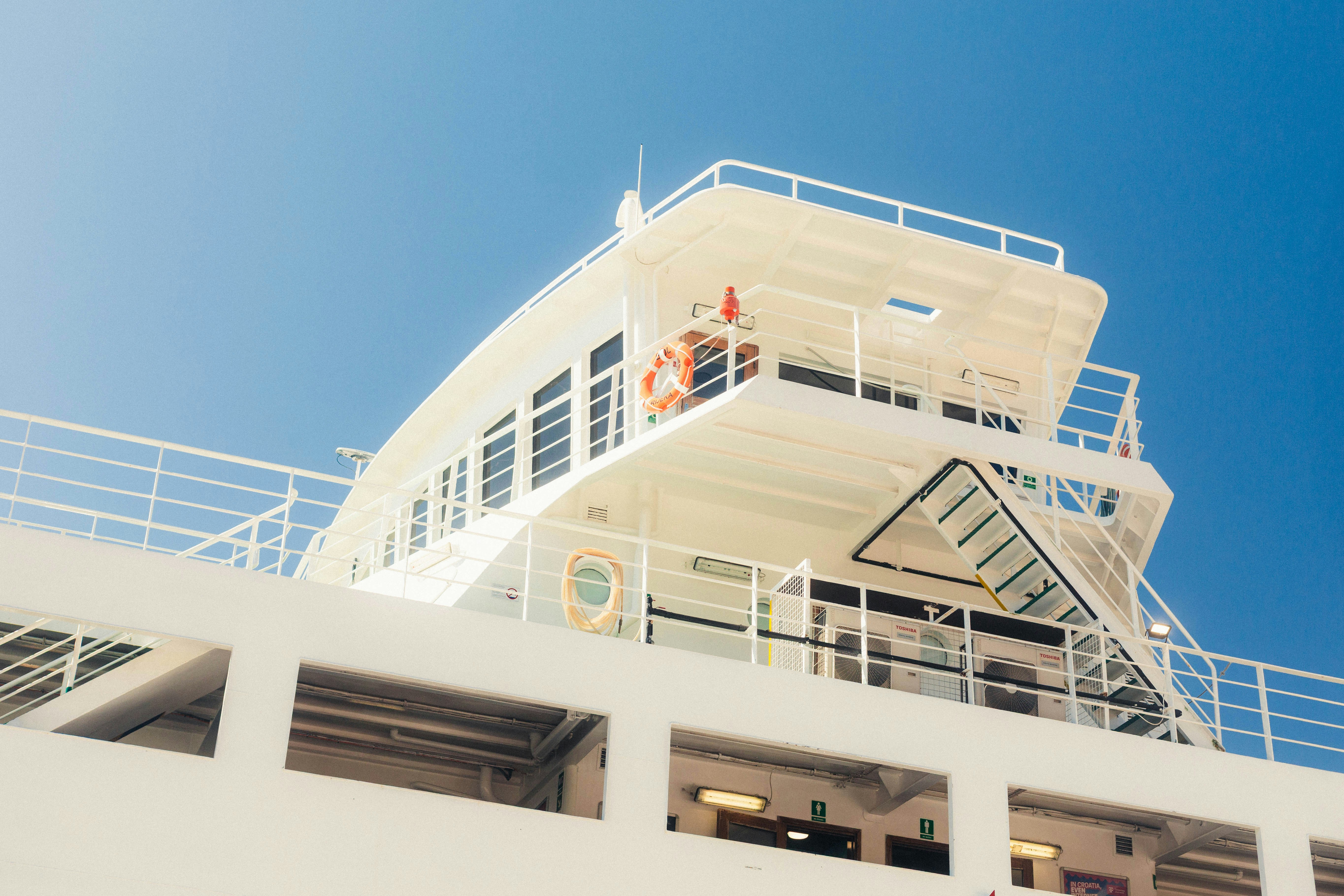 White Hi-Ride: The Ship's Elevated Bridge Against a Cerulean Sky
