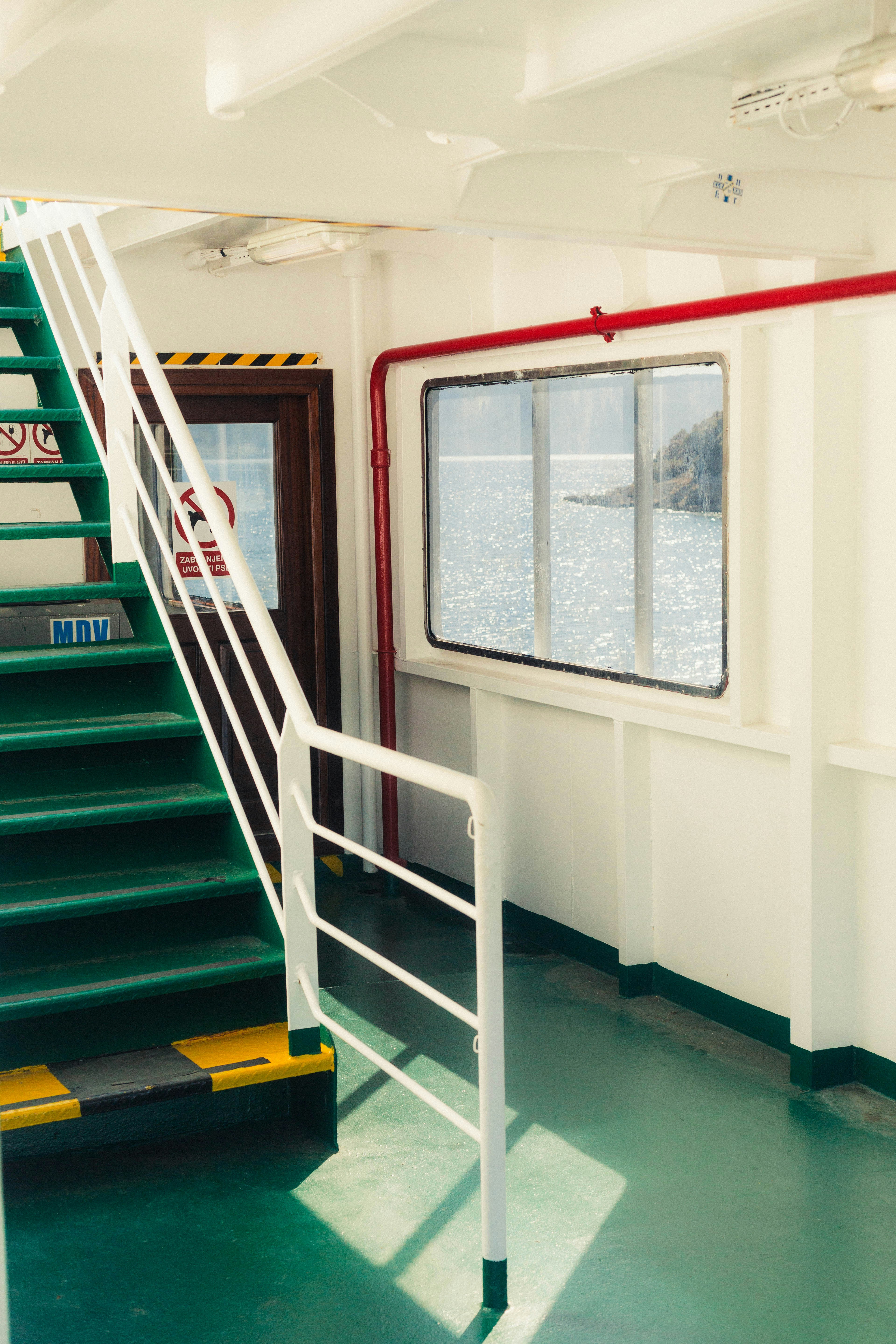 Sea Window Shuffle: Light, Steps, and Railings on a Ferry