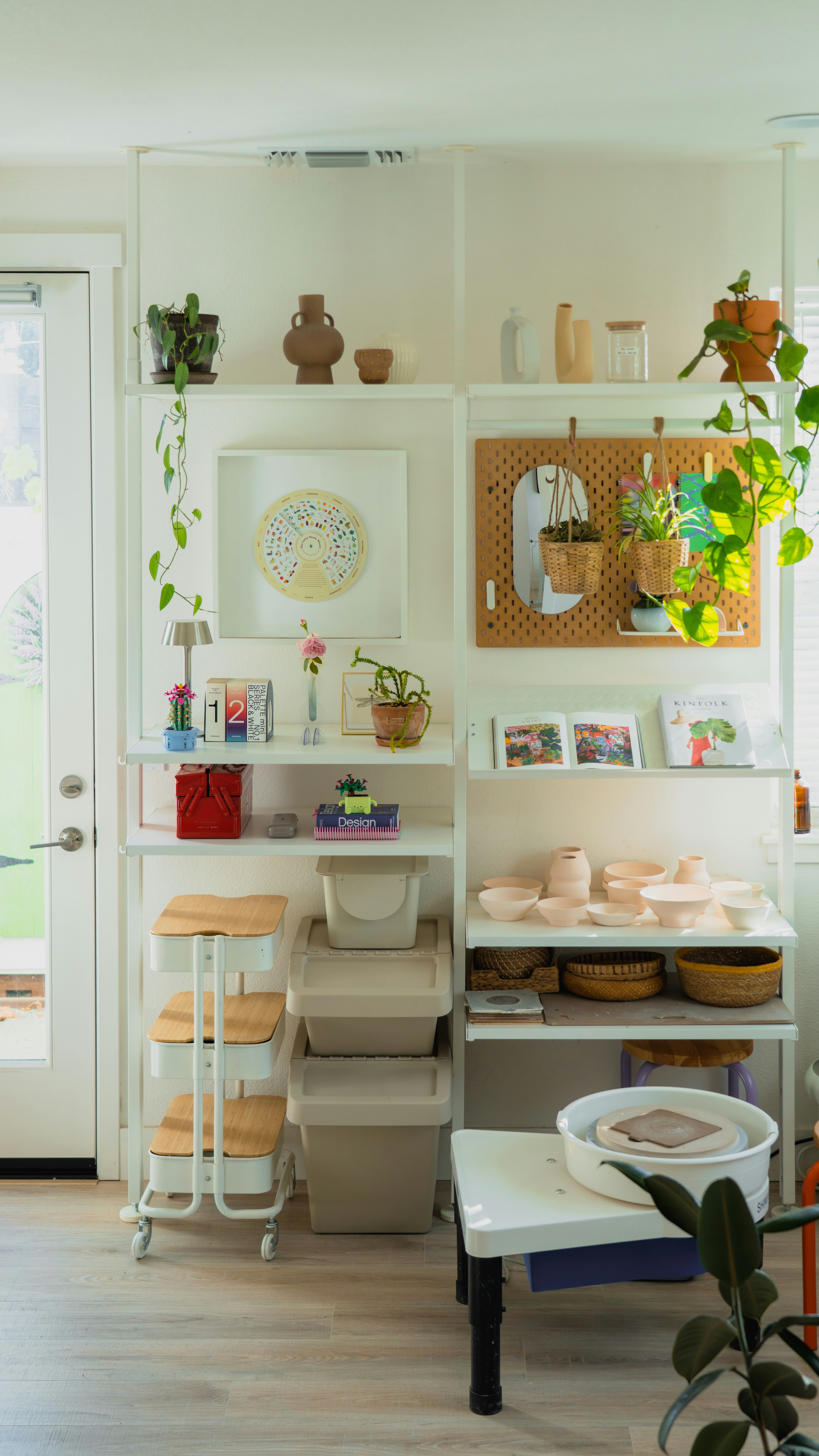 Pastel Studio: A Bright Wall of Organized Craft Shelves