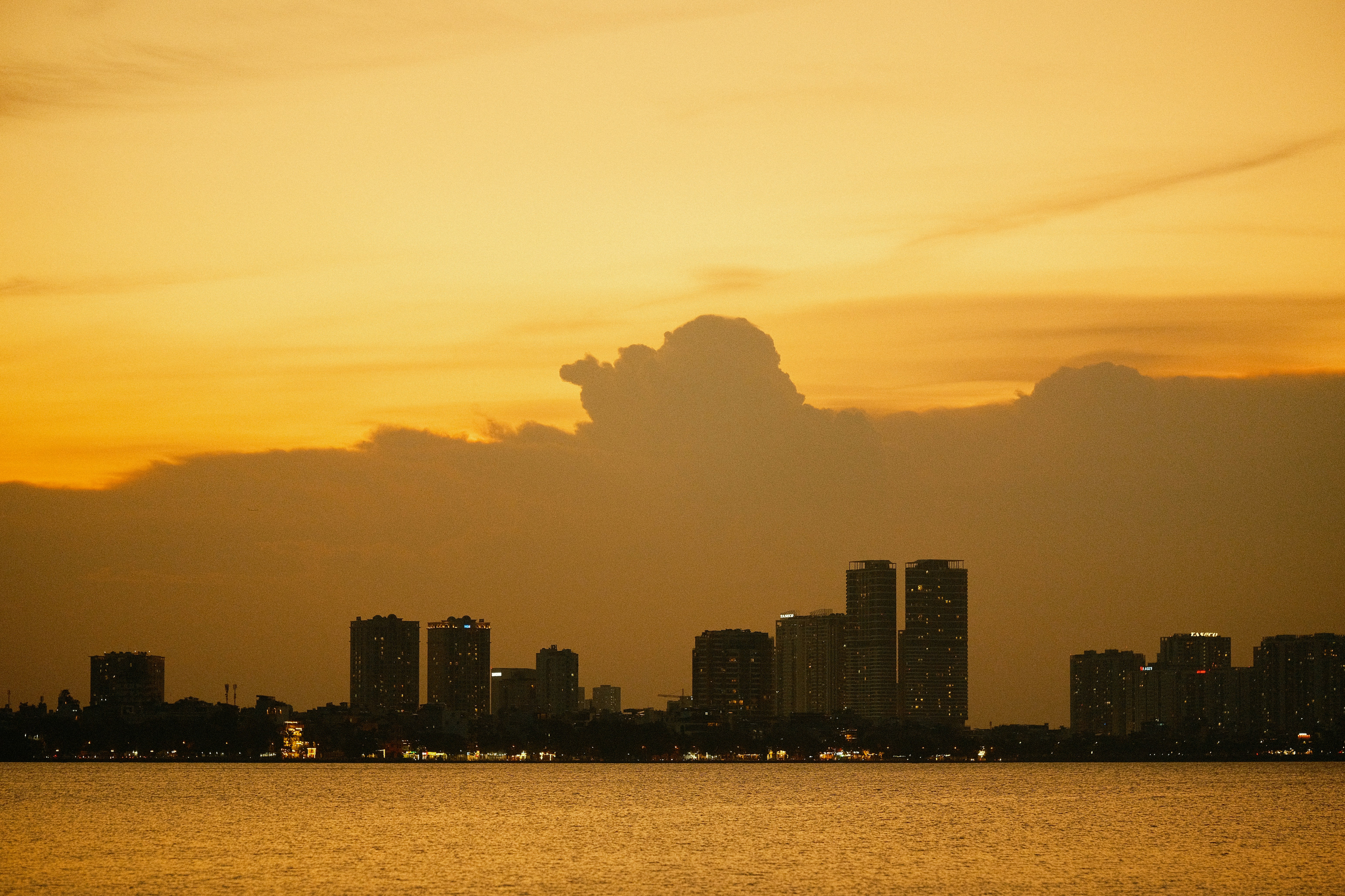 Golden Horizon: Urban Silhouette at Sunset