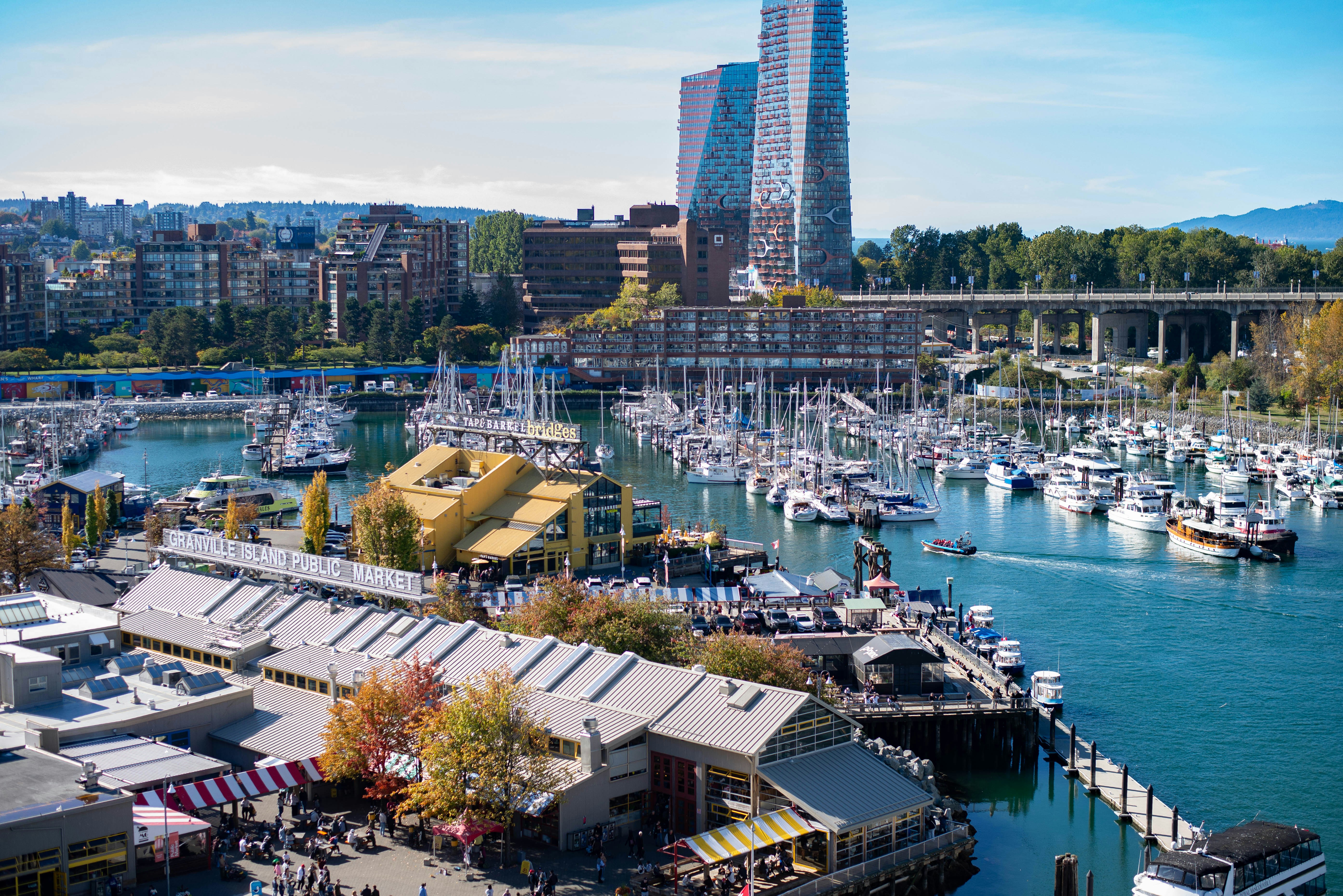 Harbor Junction: Boats, Market, and Towers under a Cerulean Sky