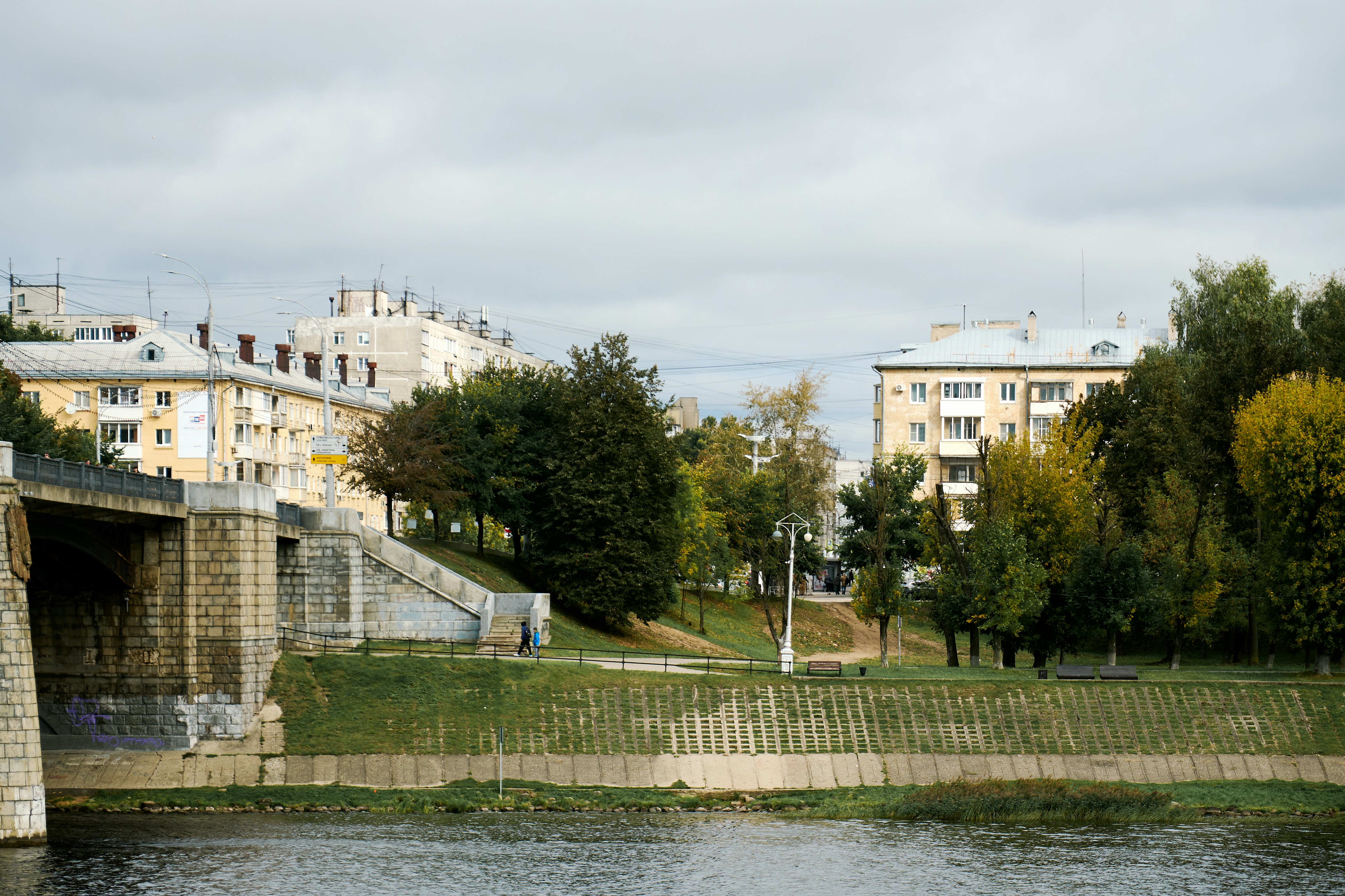 Riverside Mosaic: Urban Dwellings Framing a Quiet Park