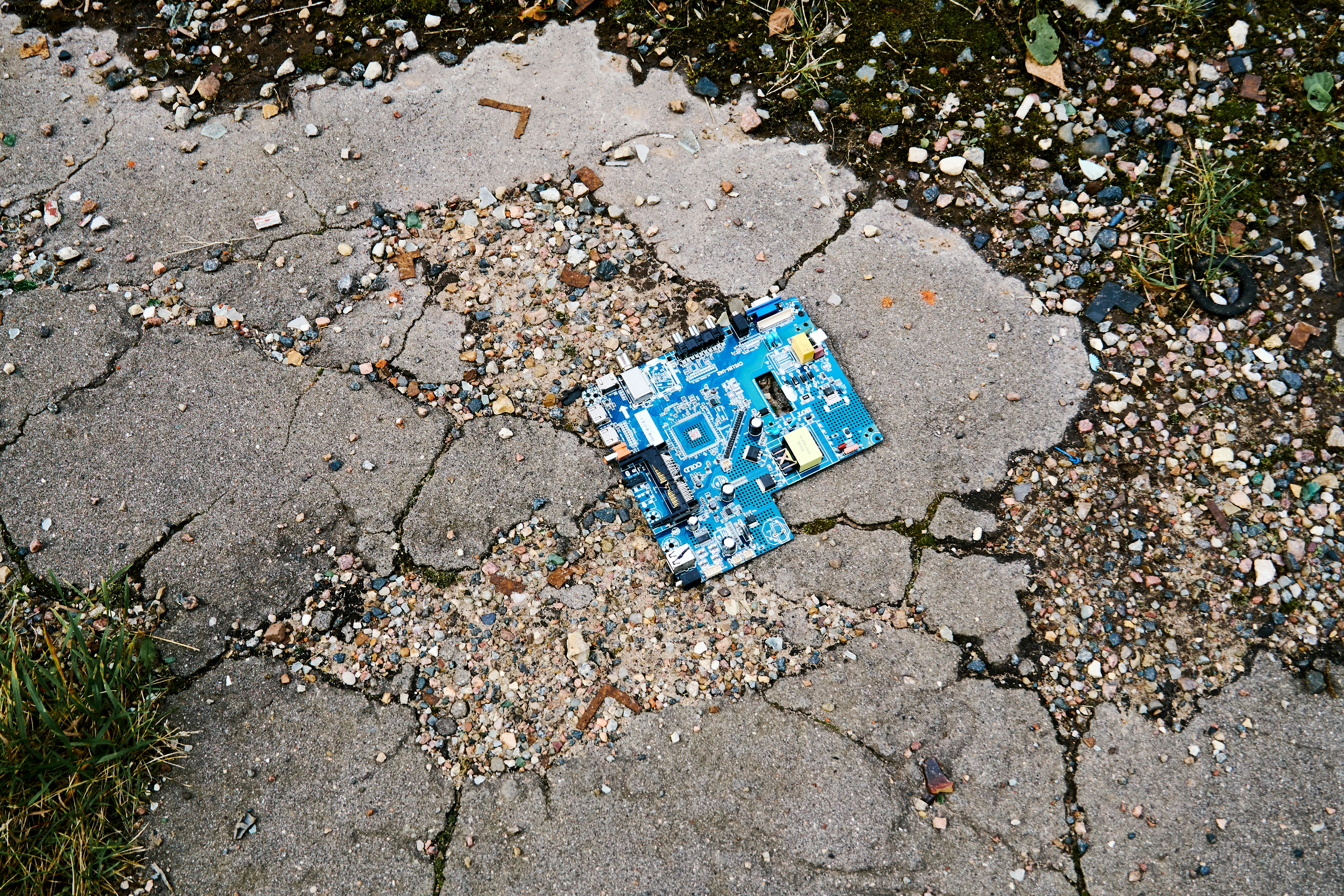 Crumbled Chips on a Weathered Concrete Patch