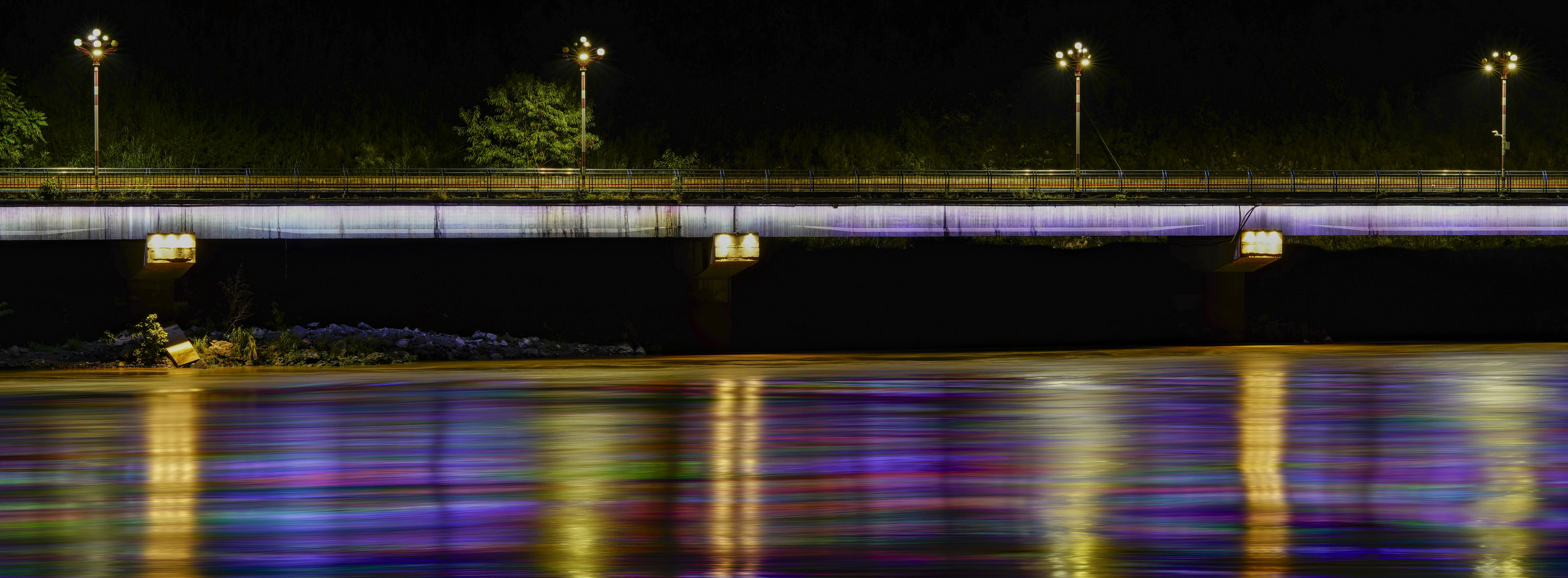 Neon Reflections Under the Night Bridge