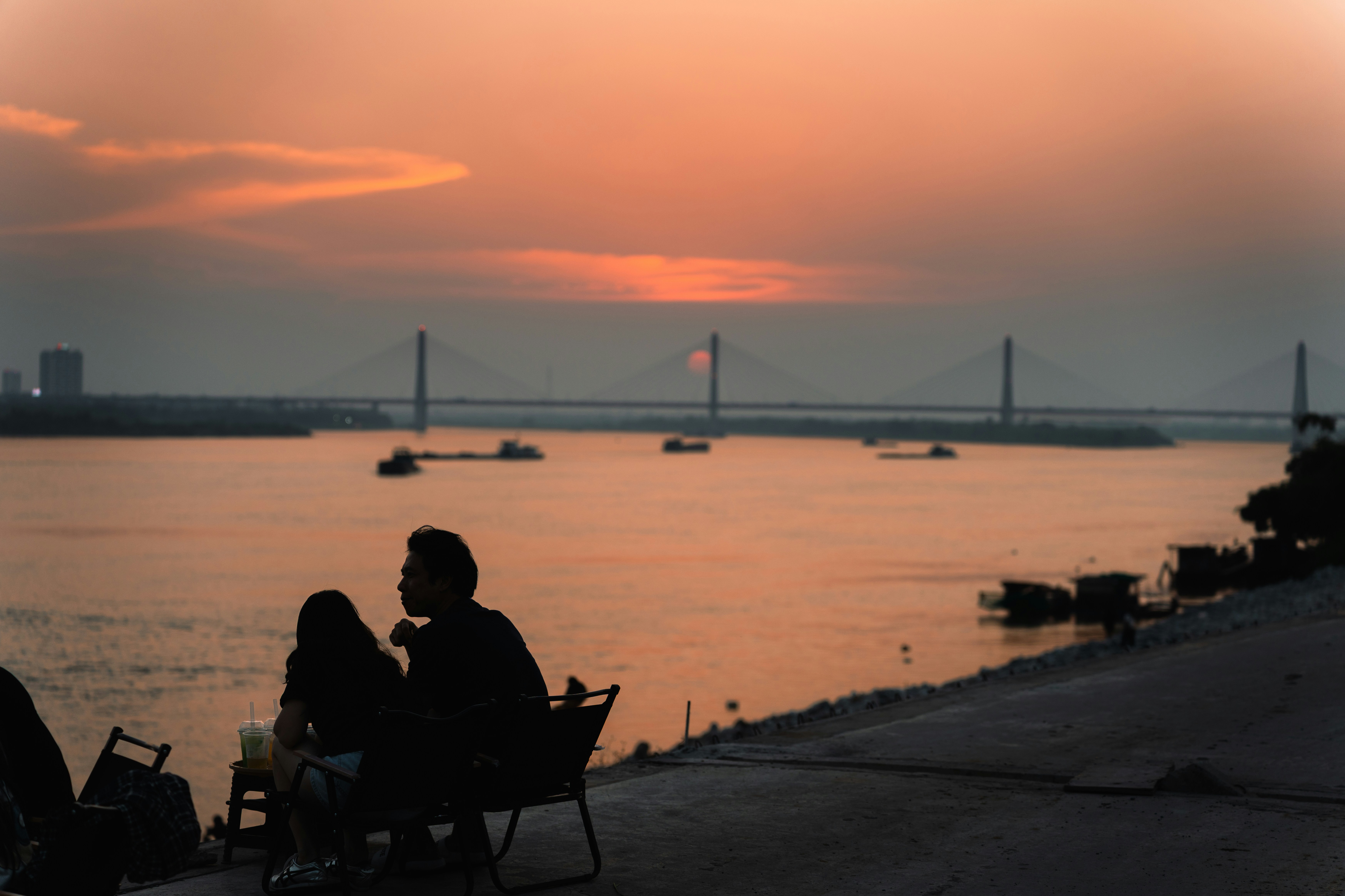 Quiet Evening by the Water: Silhouettes and Serene Sunset