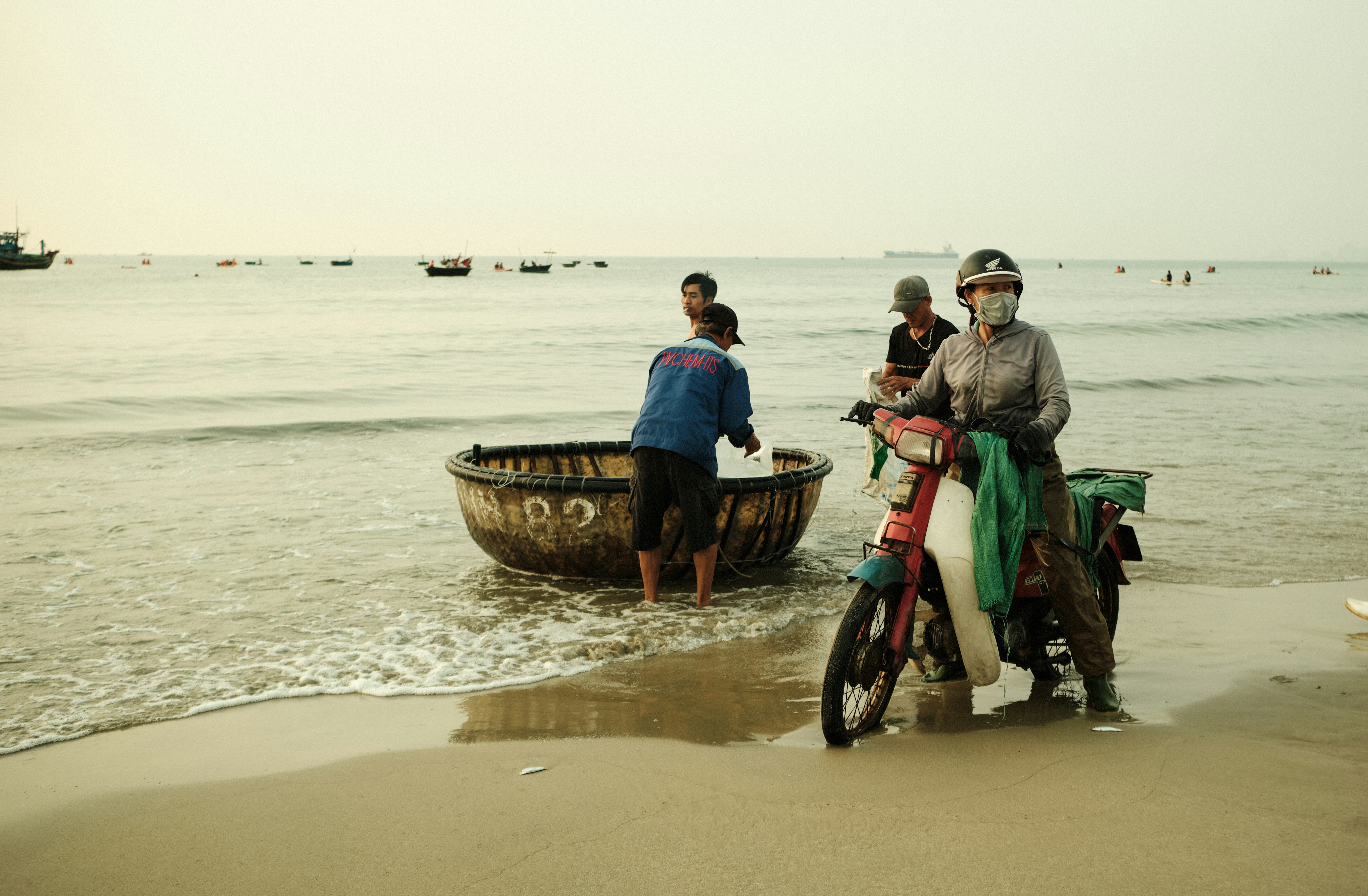Coastal Morning: Fisherman and Scooter by the Shore