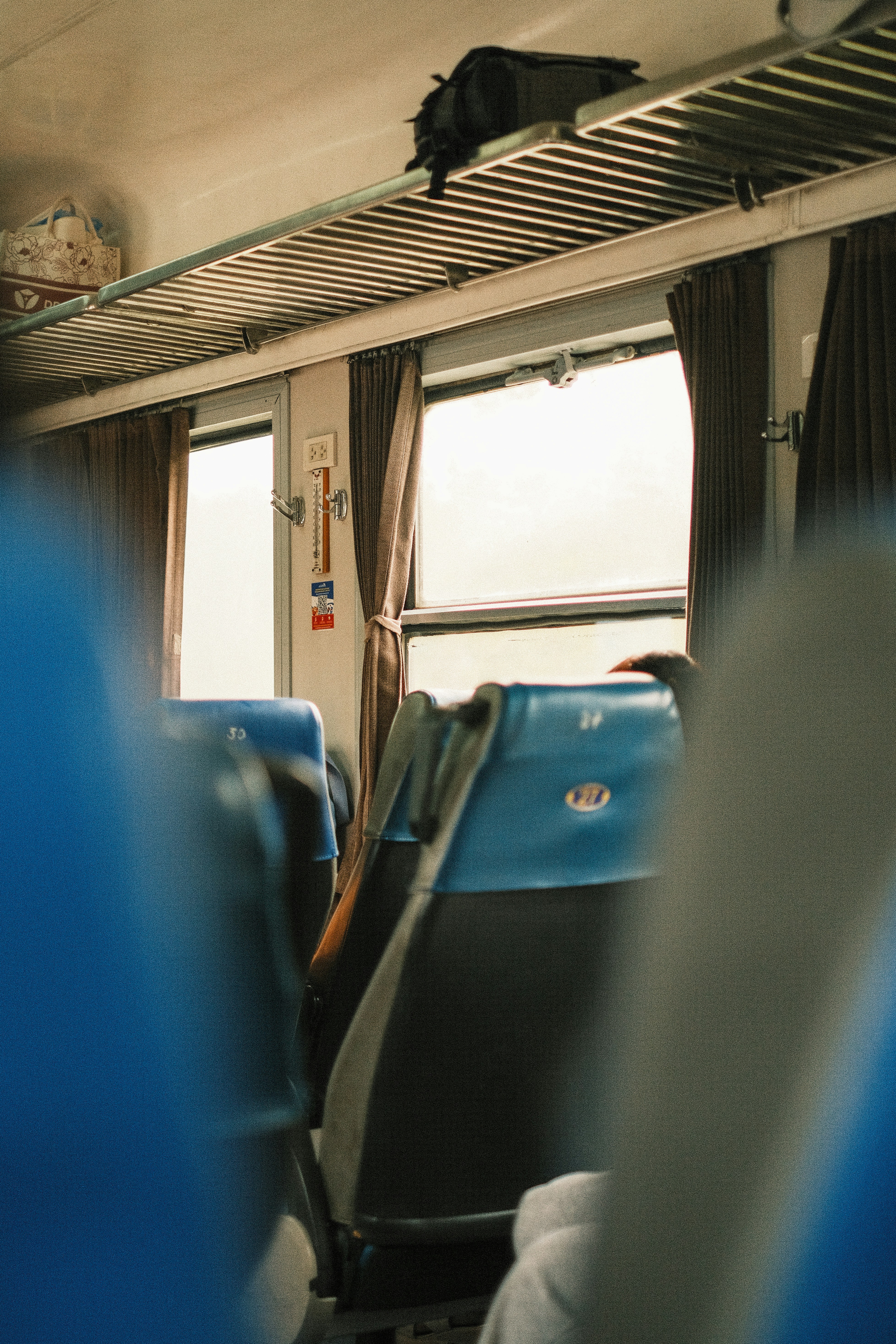 Blue Seats on a Quiet Intercity Ride