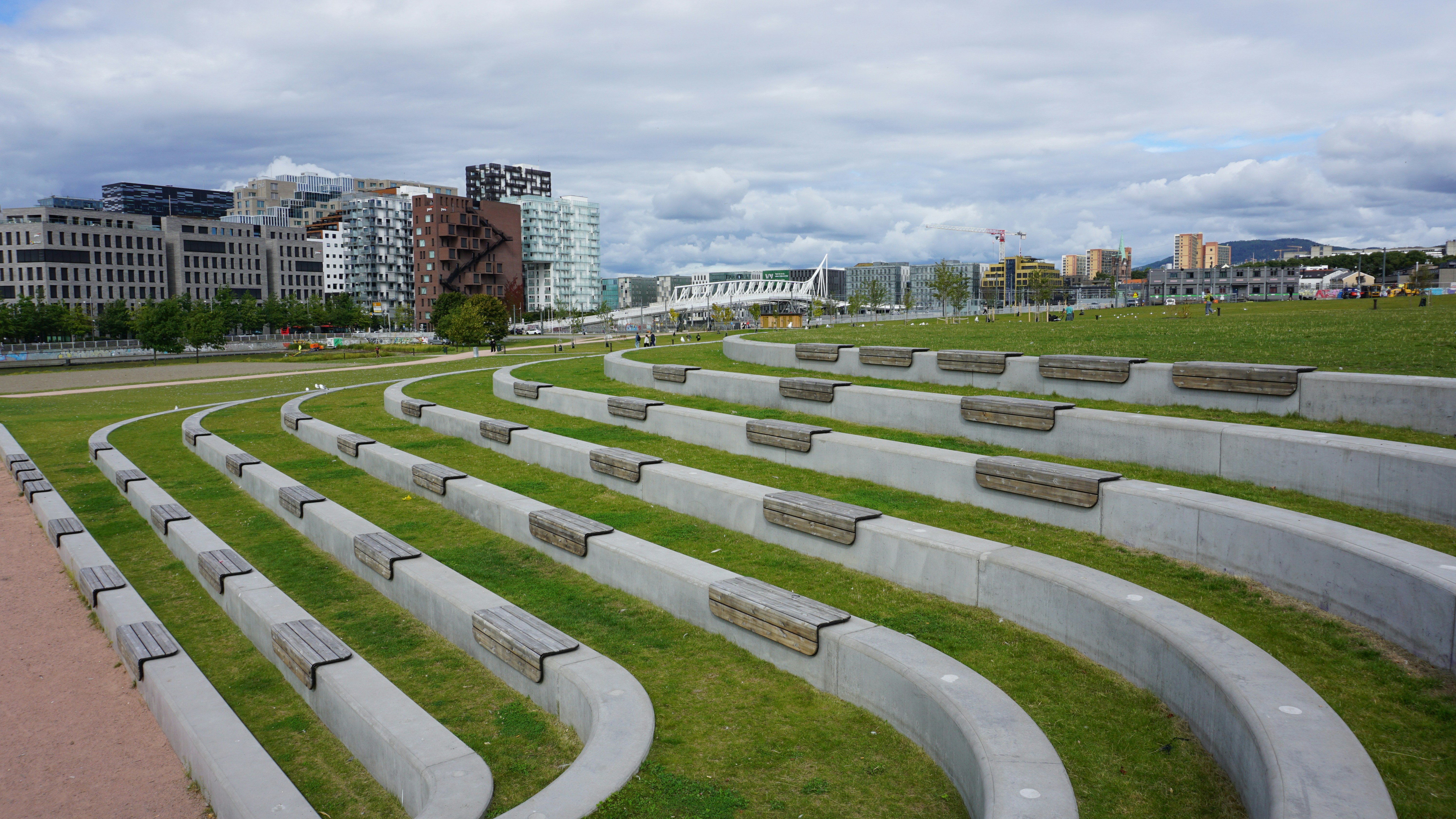 Concrete Carved Steps: An Urban Amphitheater Gently Embraced by Skyscrapers