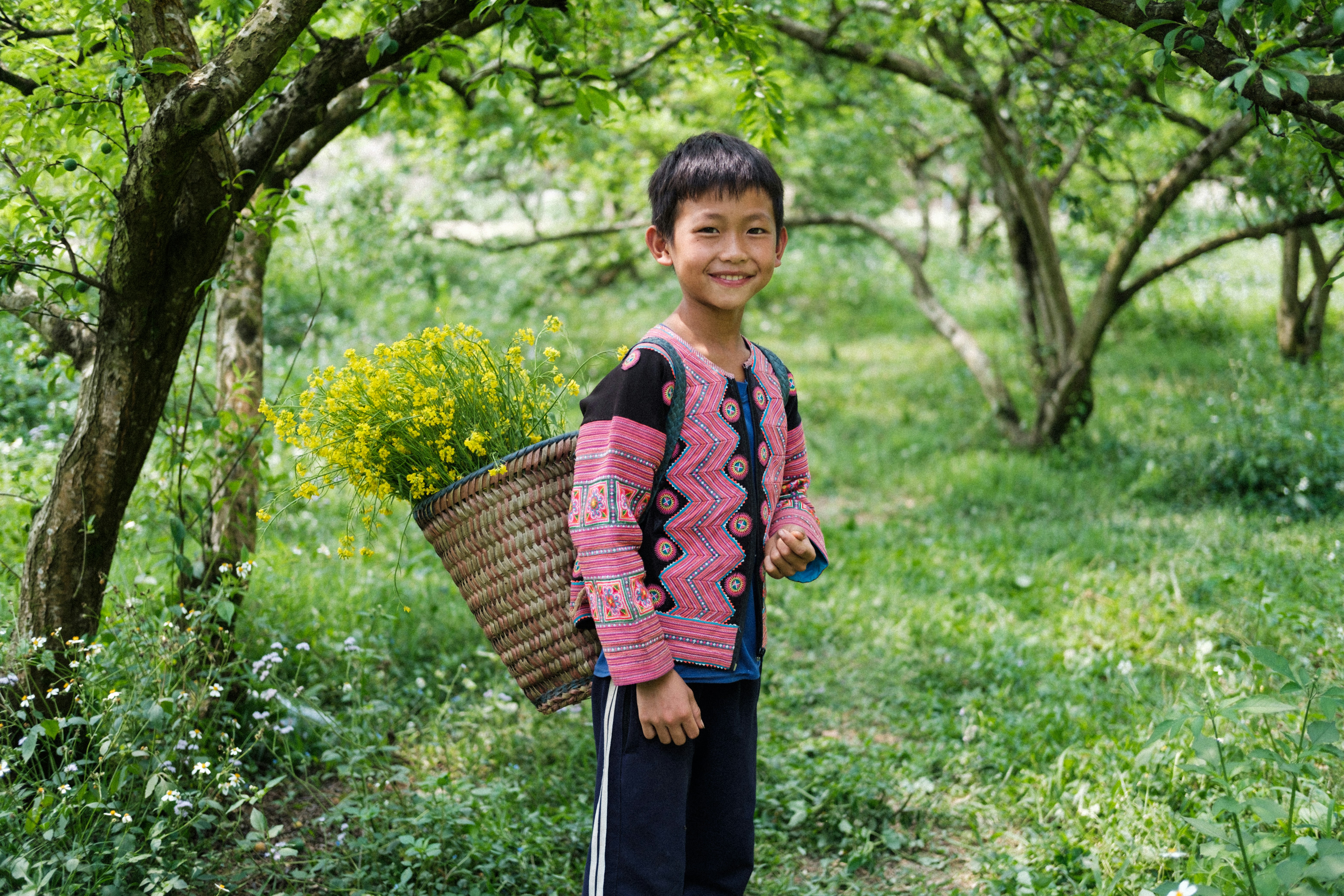 Sunny Orchard Stroll: A Young Vendor with Wildflowers