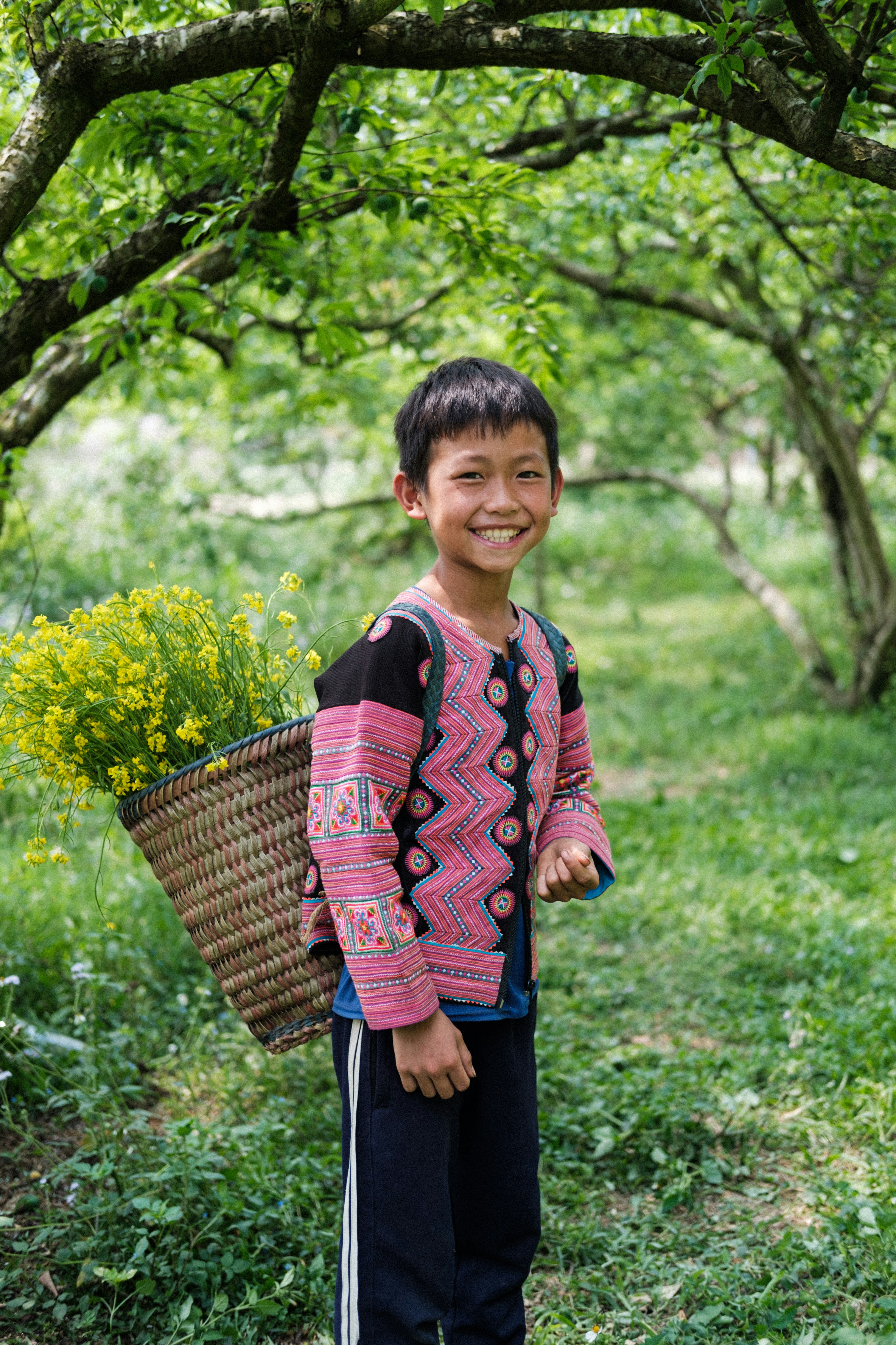 Joyful Trek: A Child in a Flower-filled Orchard