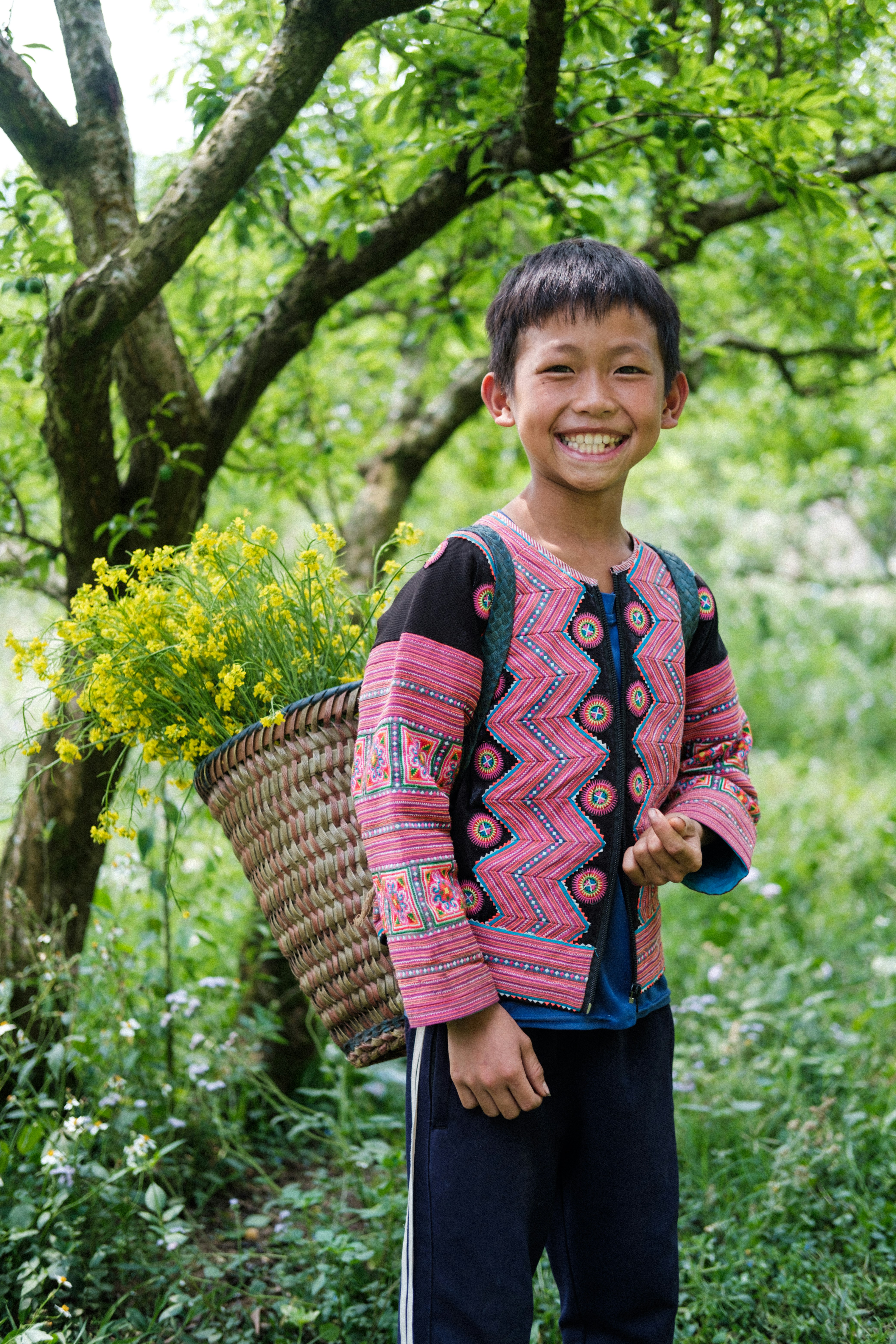 Joy in the Orchard: A Smiling Basket Carrier in Bloom