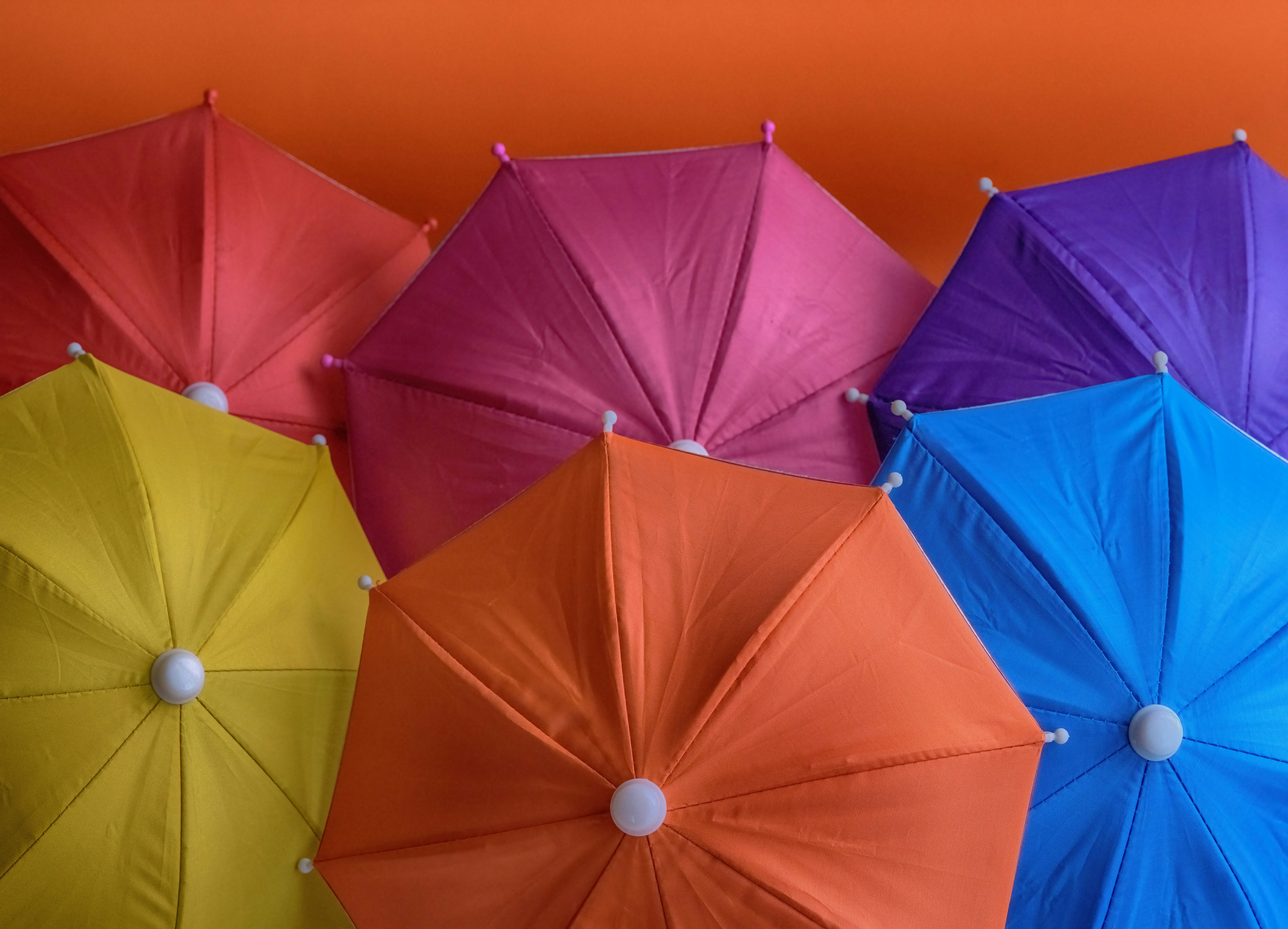 A Fleet of Colorful Umbrellas: Geometric Harmony in a Crowded Canopy