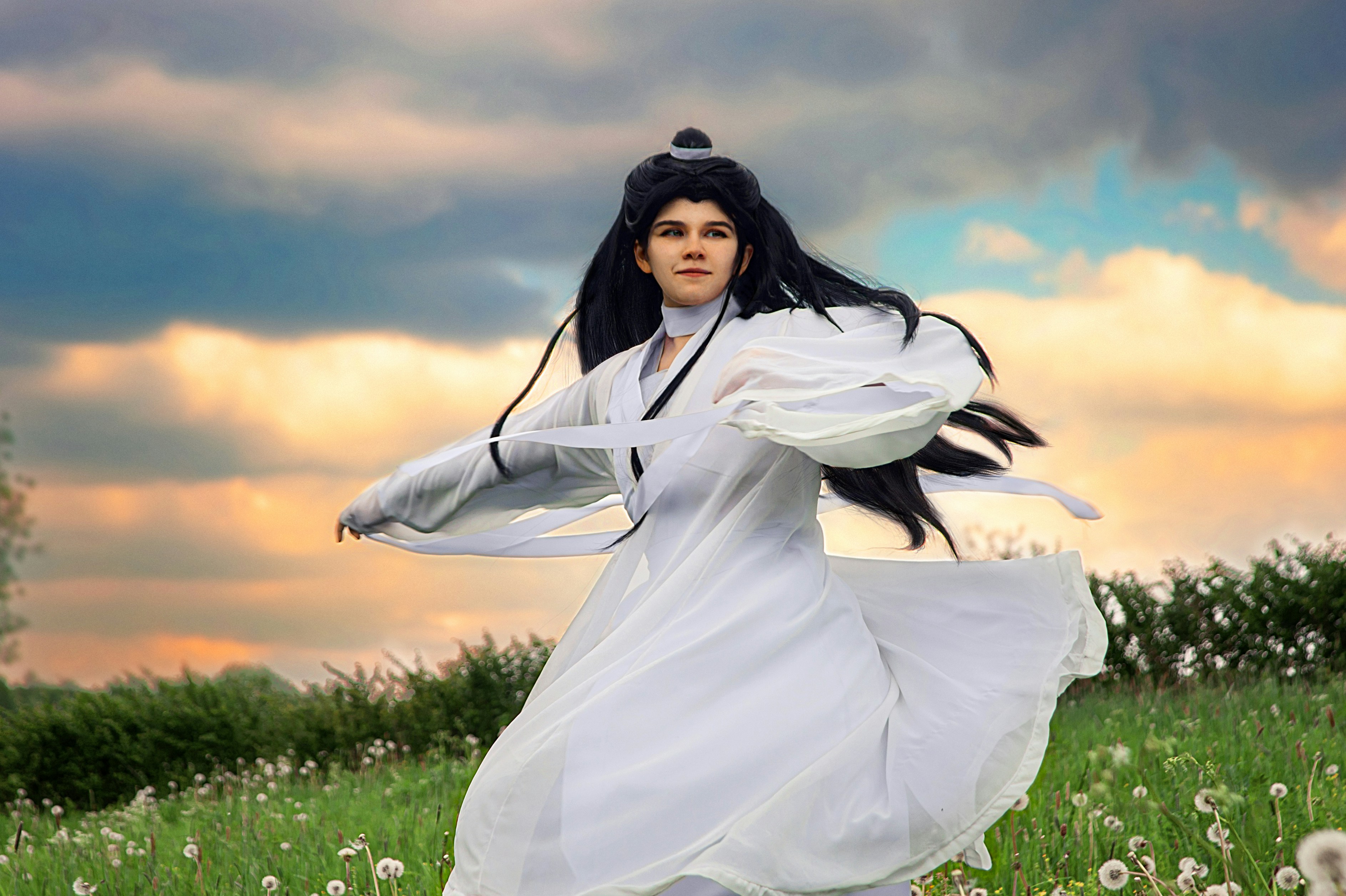 Flowing White Garment Against Dusk-Cloud Sky