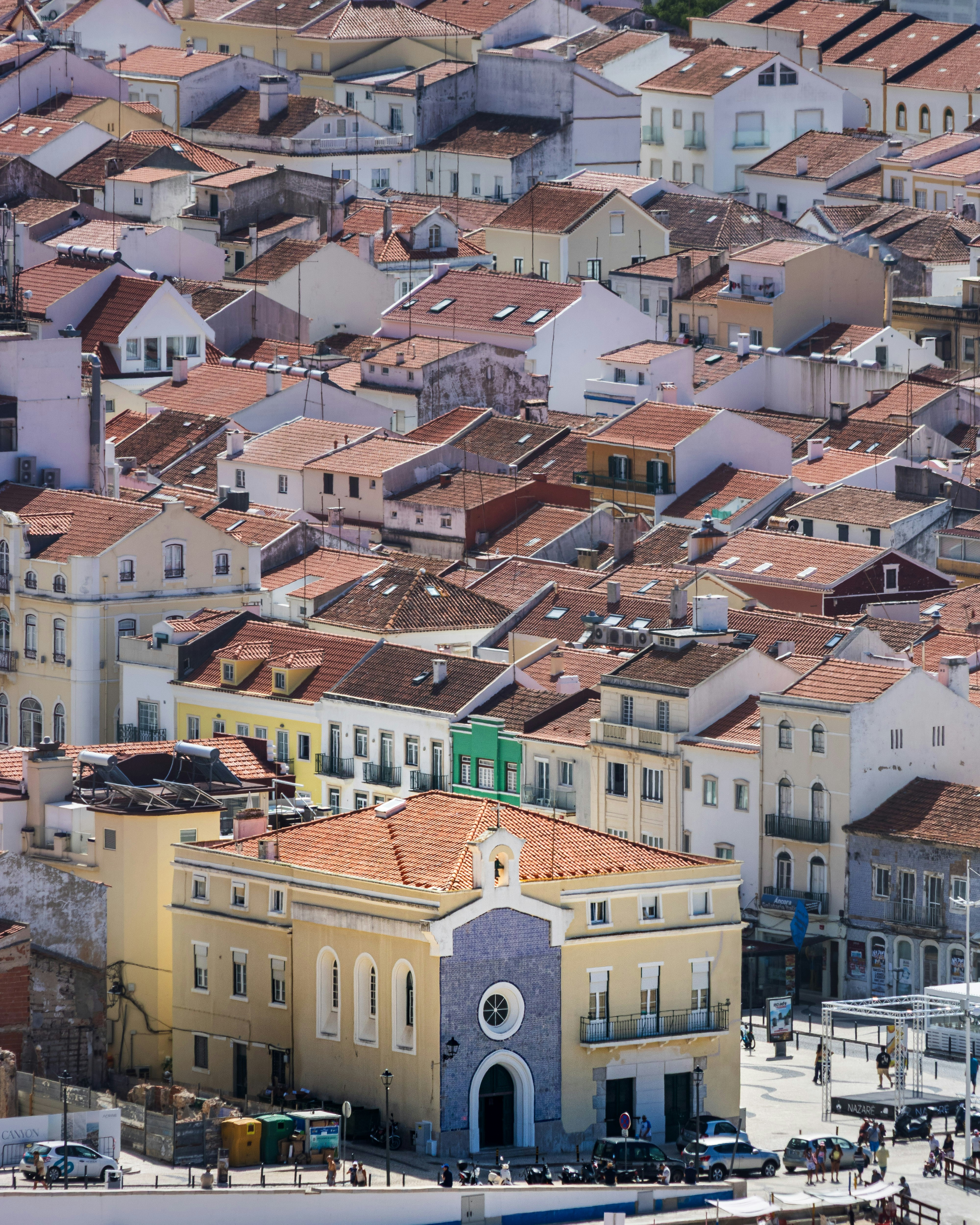 Colorful Mediterranean Facades Stack in a Sunlit Coastal Town