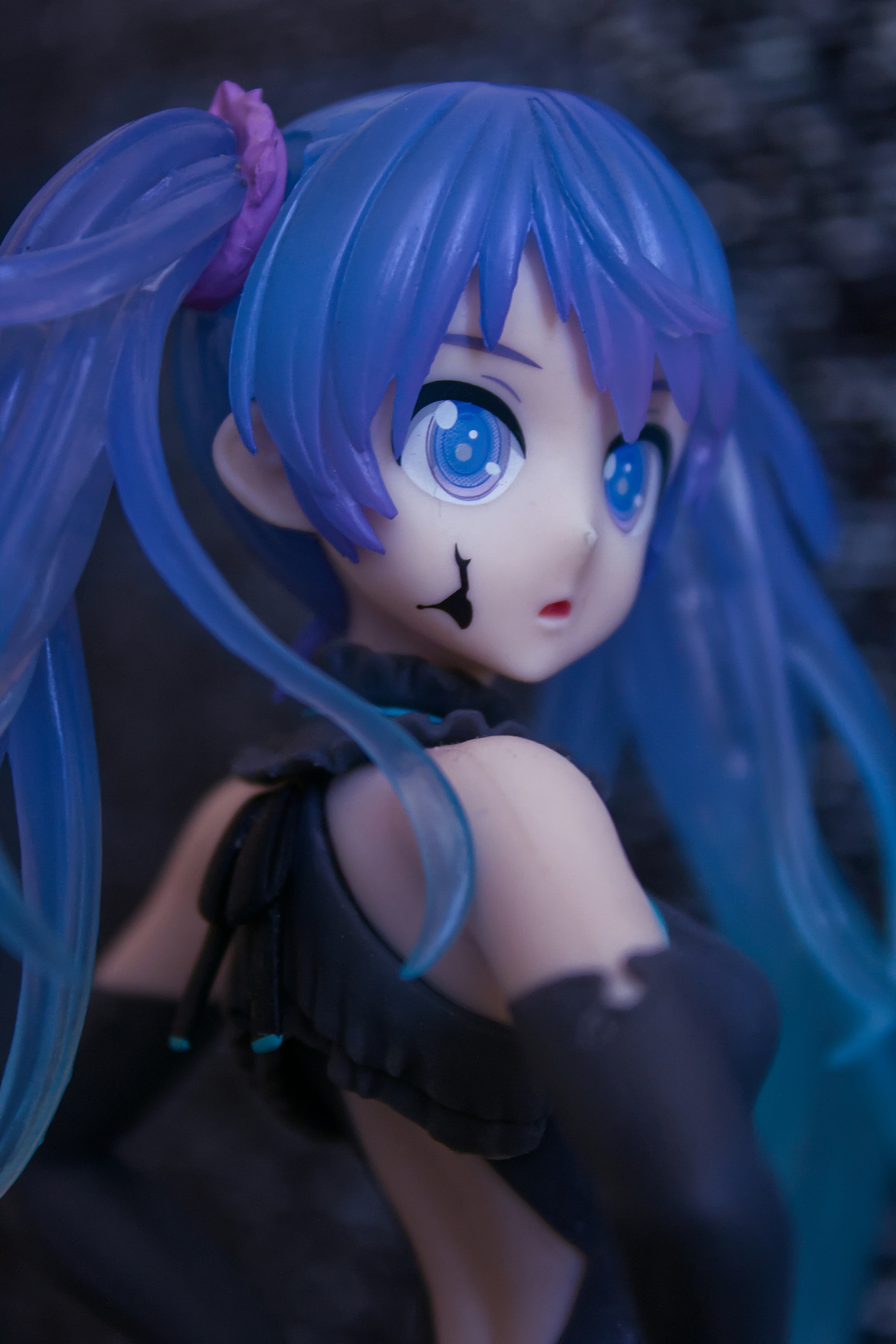 Blue-Tressed Portrait: A Close-Up of a Veiled Vocaloid Figurine