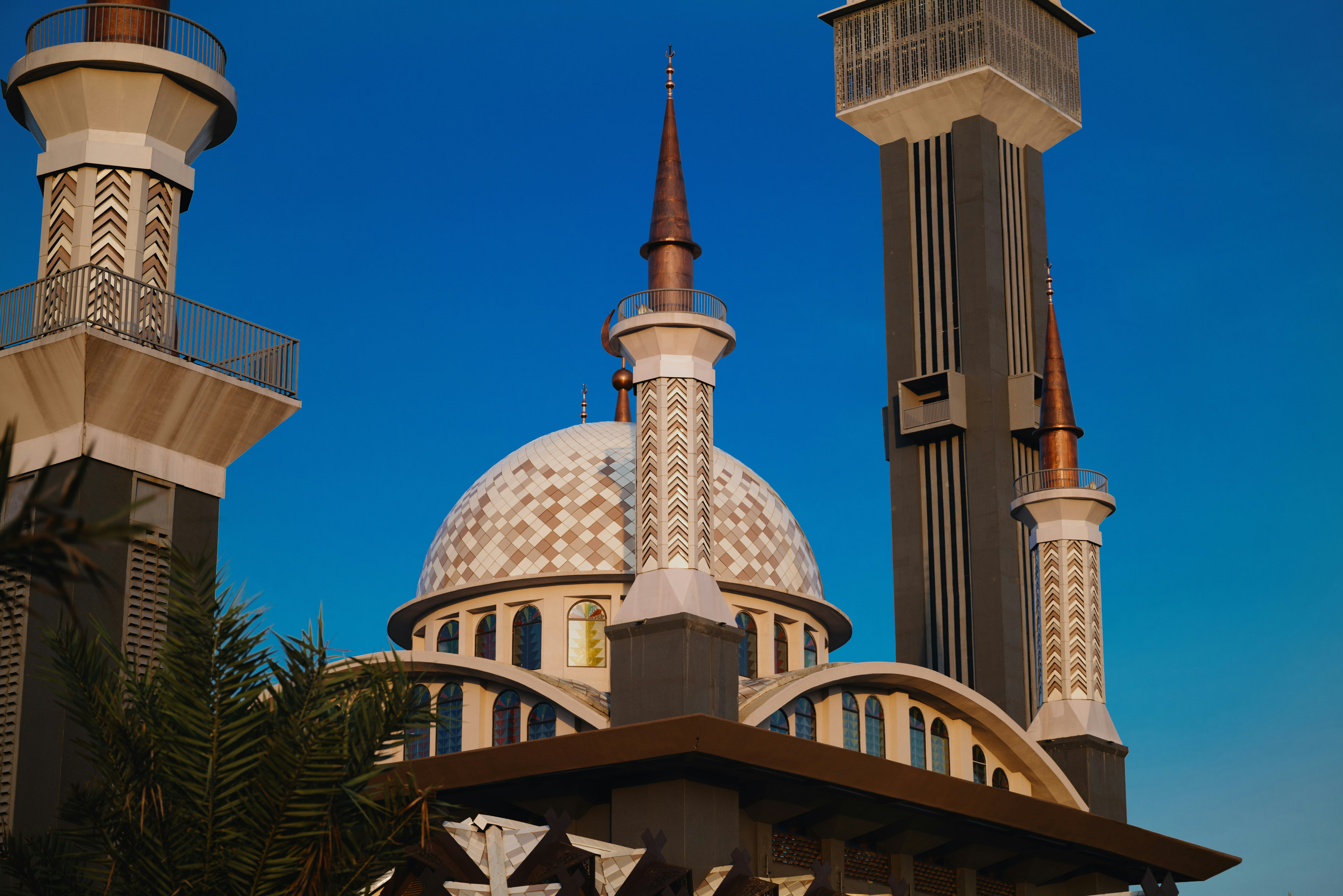 Dome of a Mosque Silhouetted by Turrets Against a Clear Sky