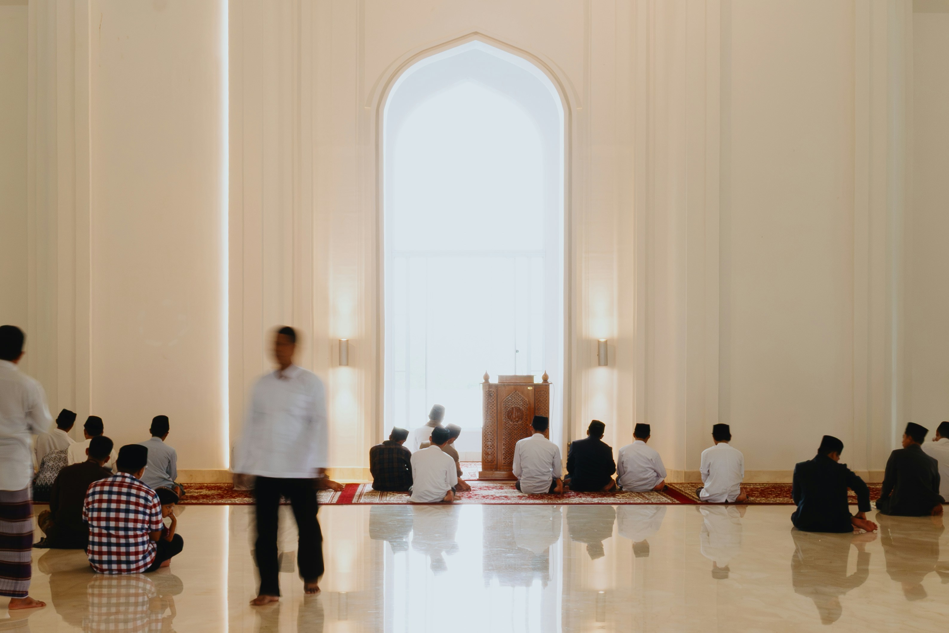 Quiet Worship: A Row of Worshippers in an Illuminated Hall