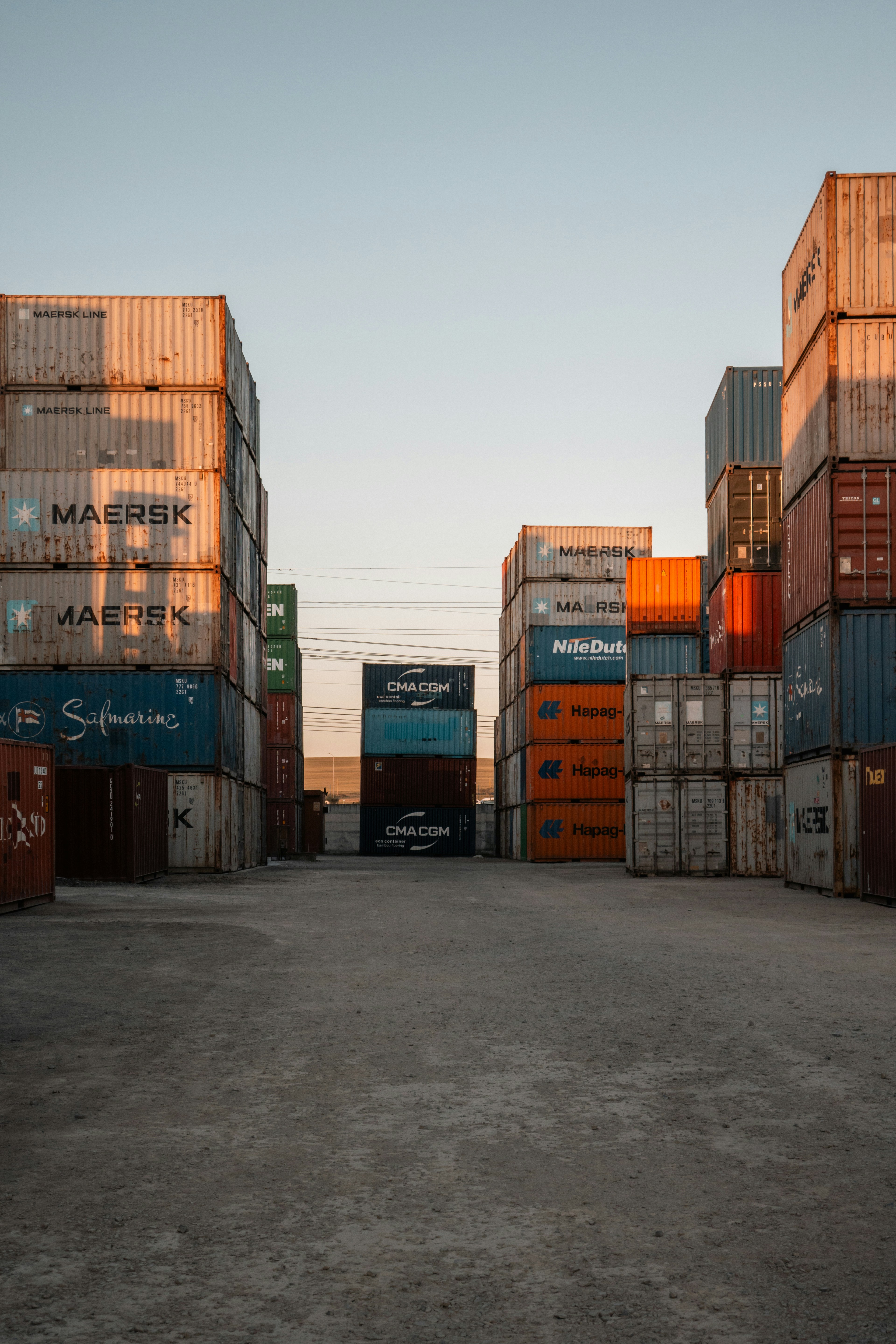 Shipping Yard Symmetry: Stacked Containers Framed by a Distant Horizon