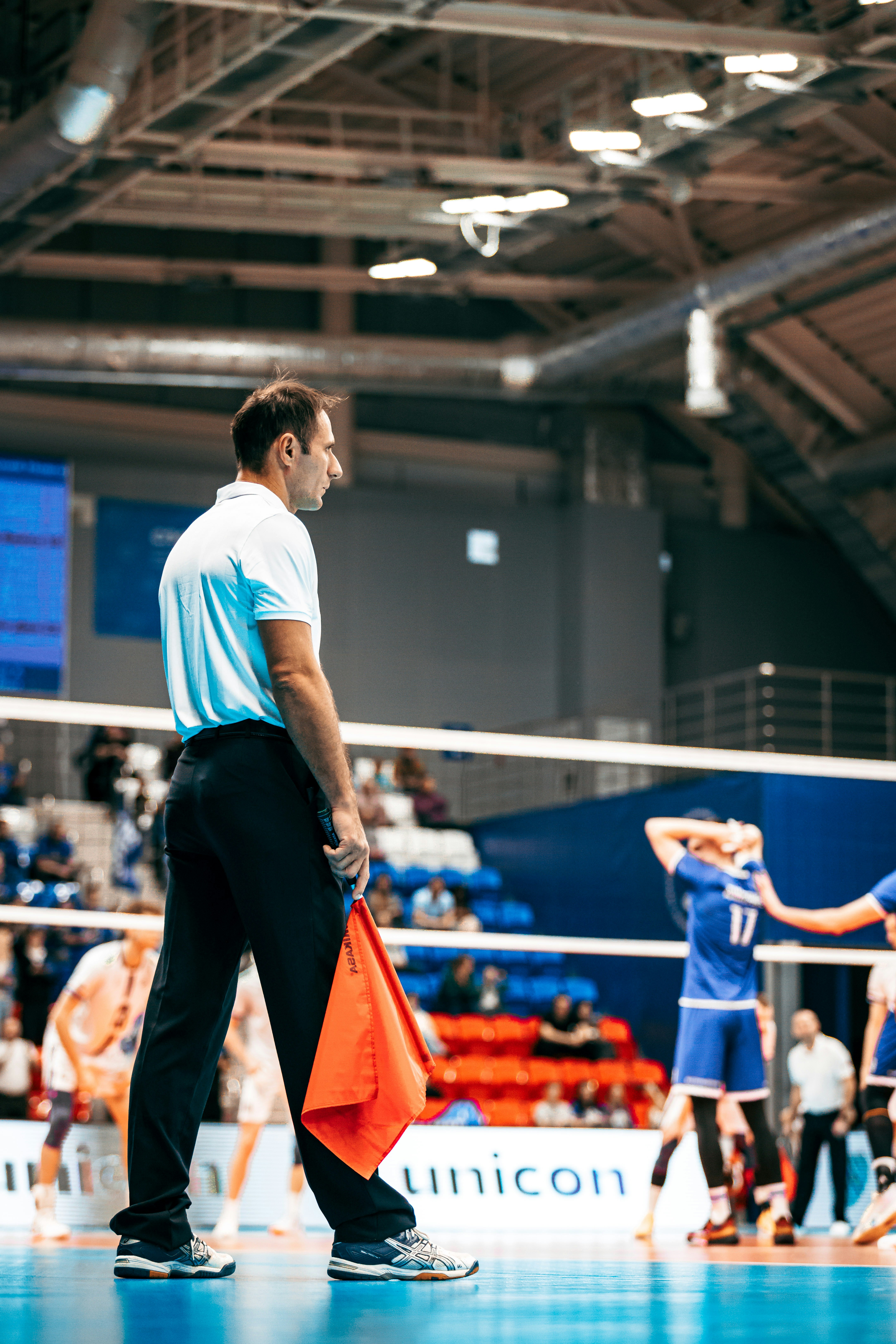 Referee in the Arena: A Quiet Moment Before the Rally