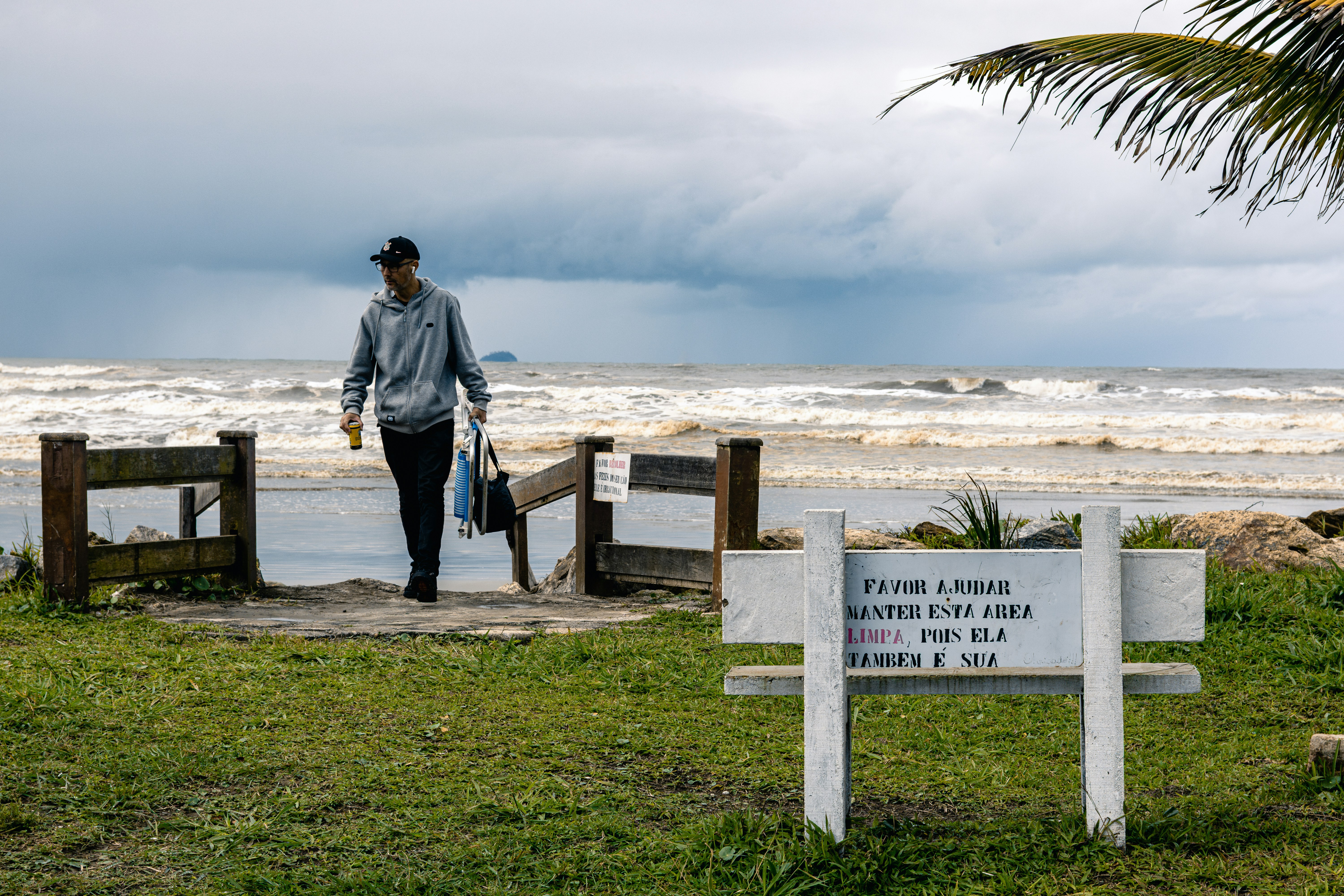 Path to the Sea: A Figure Walks Toward the Rushing Coast