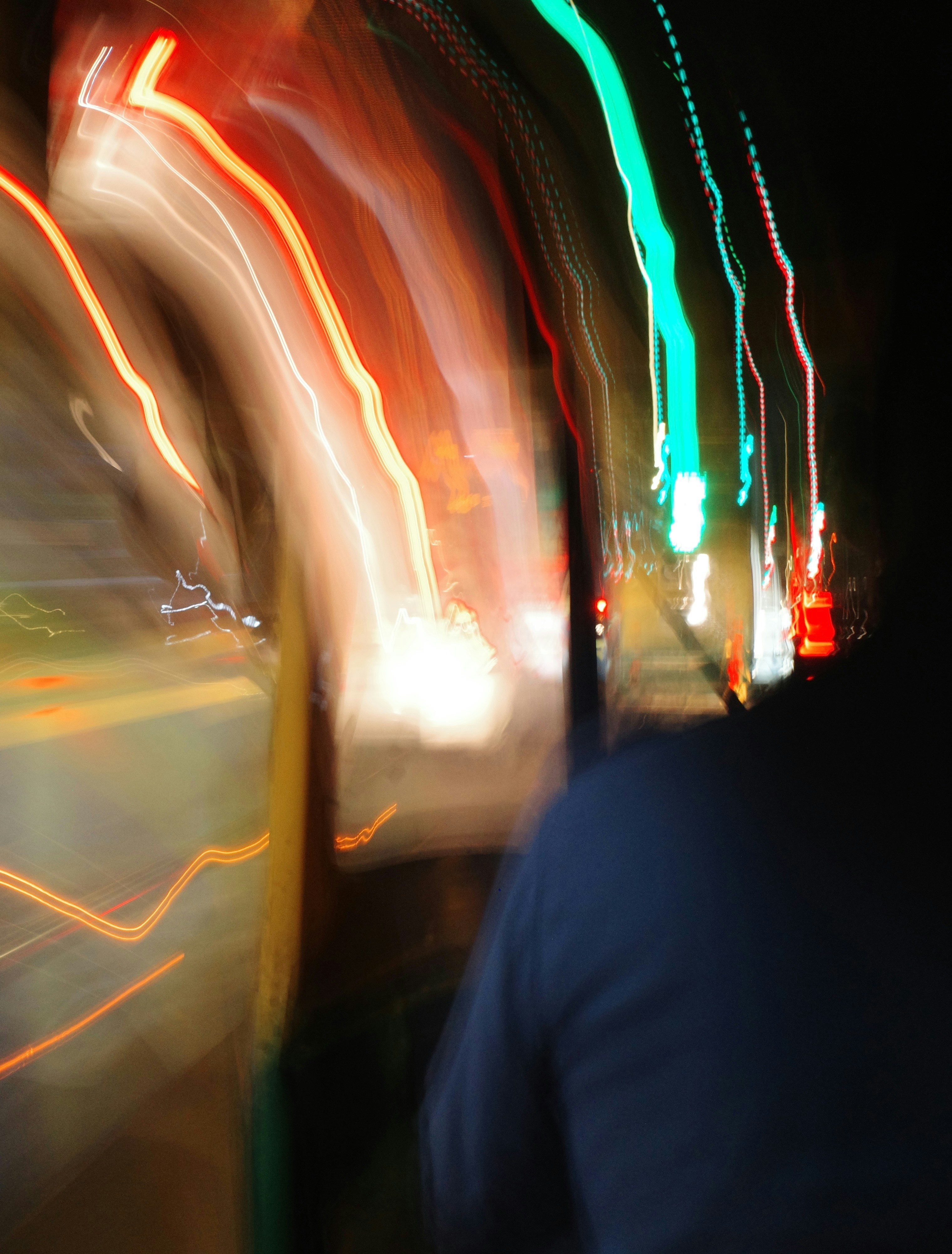 Neon Pathways: Motion Blur Through Night Traffic
