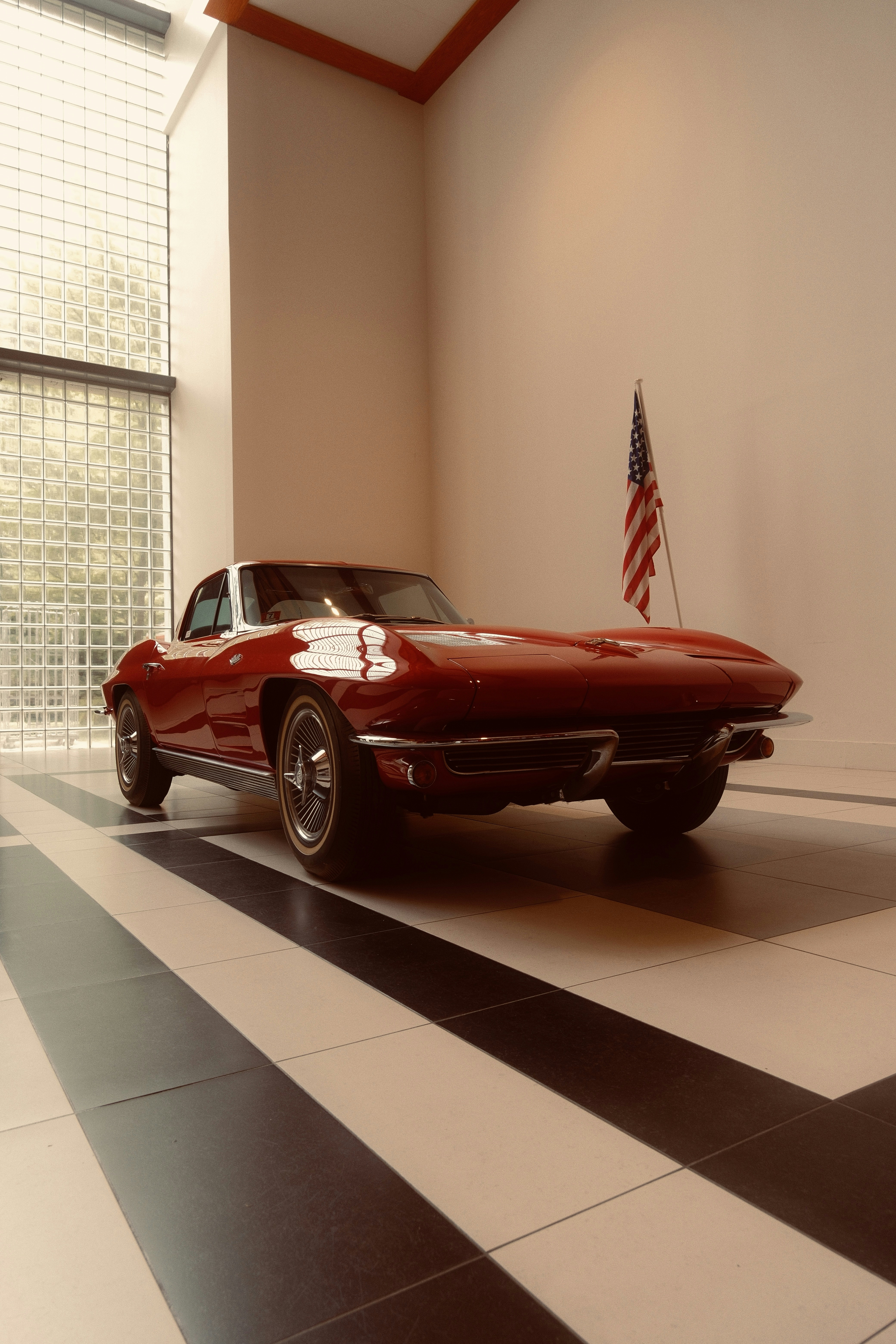 Red Classic in a Quiet Hall: American Flag Rehearses with Reflections