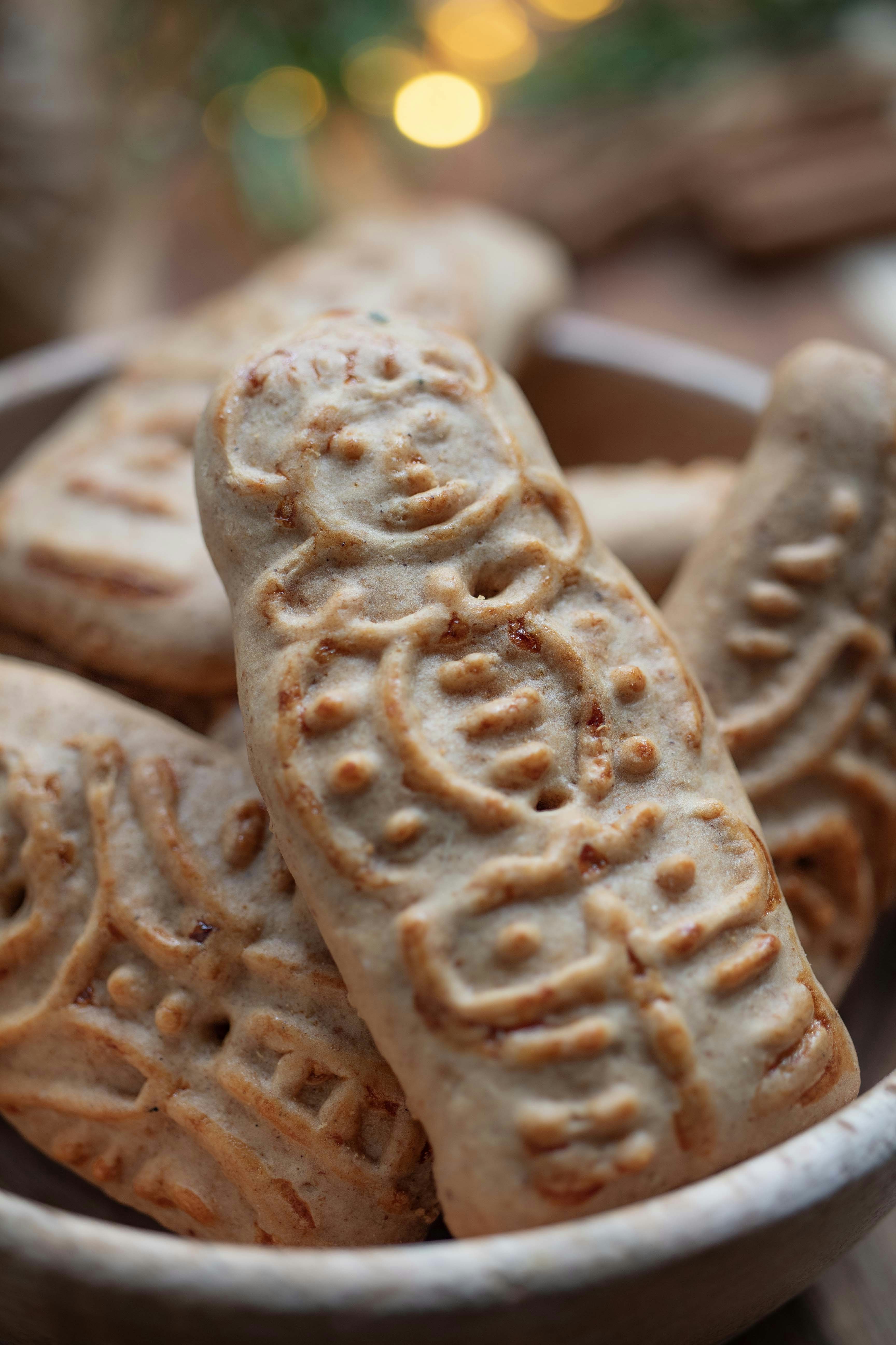 Cookie stamps in a warm bowl: a festive bite of gingerbread shapes