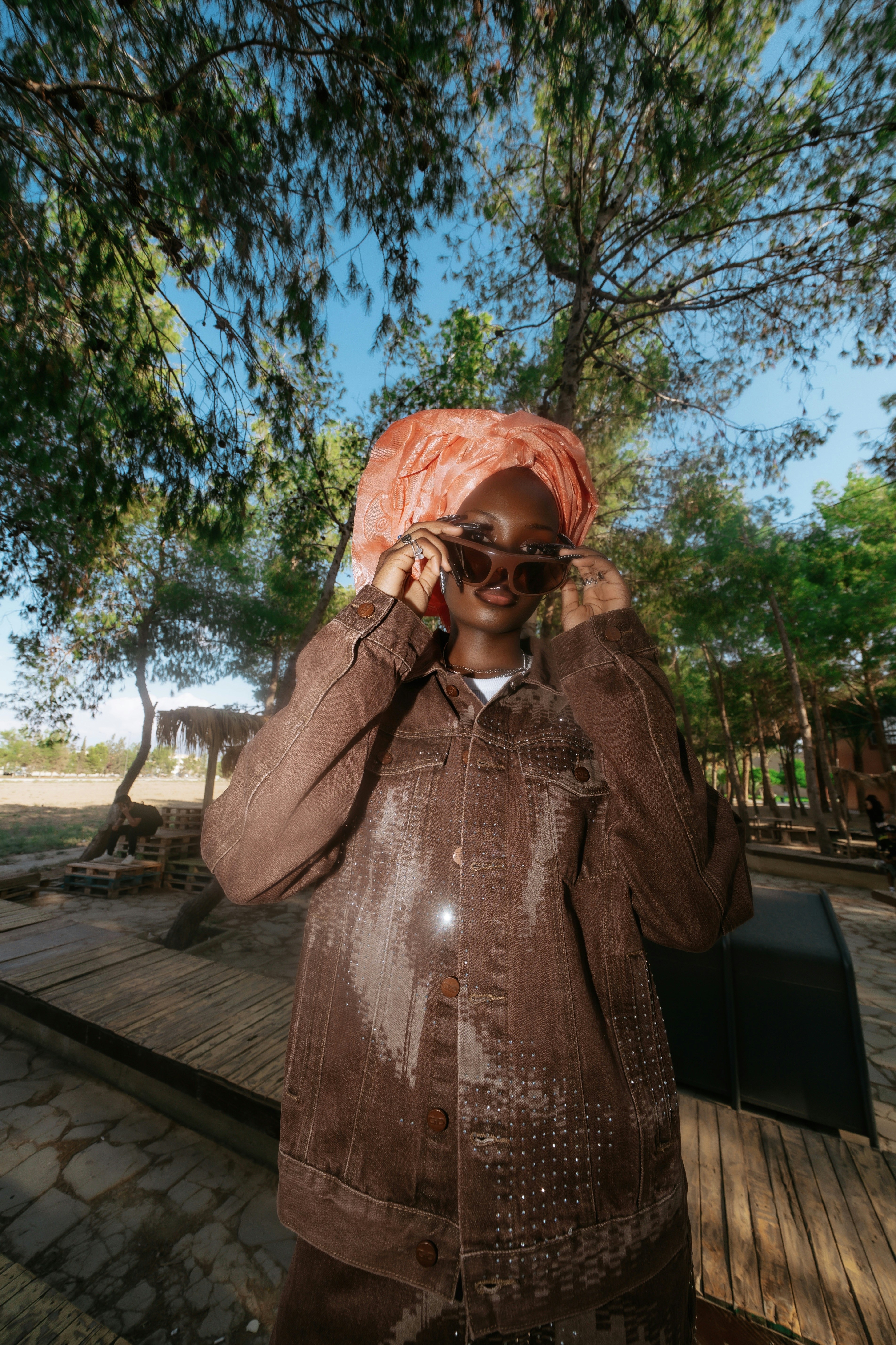 Eyes Behind the Shade: A Bold Moment in a Sunlit Clearing