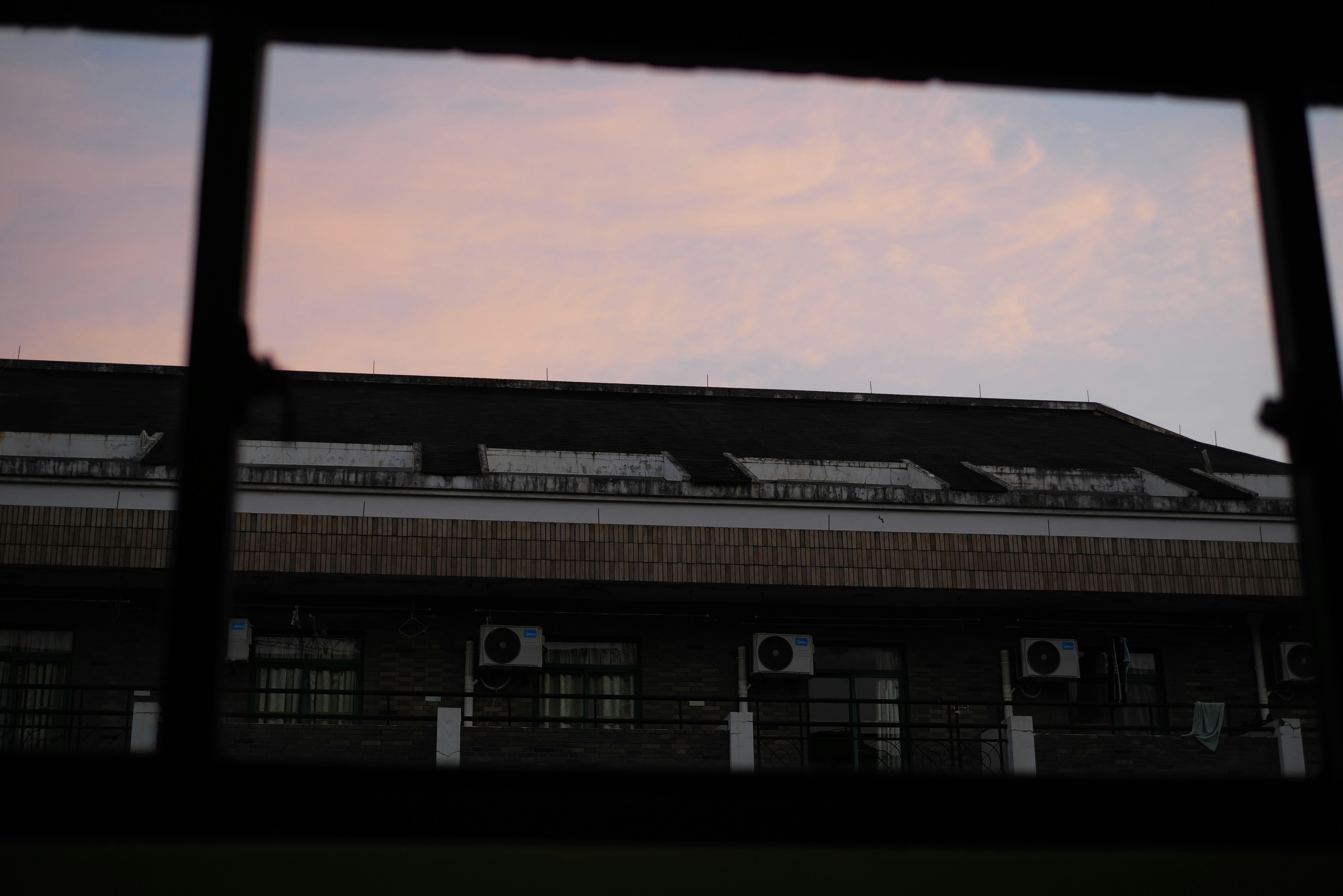 Windowed Silence Over a Quiet Industrial Roof