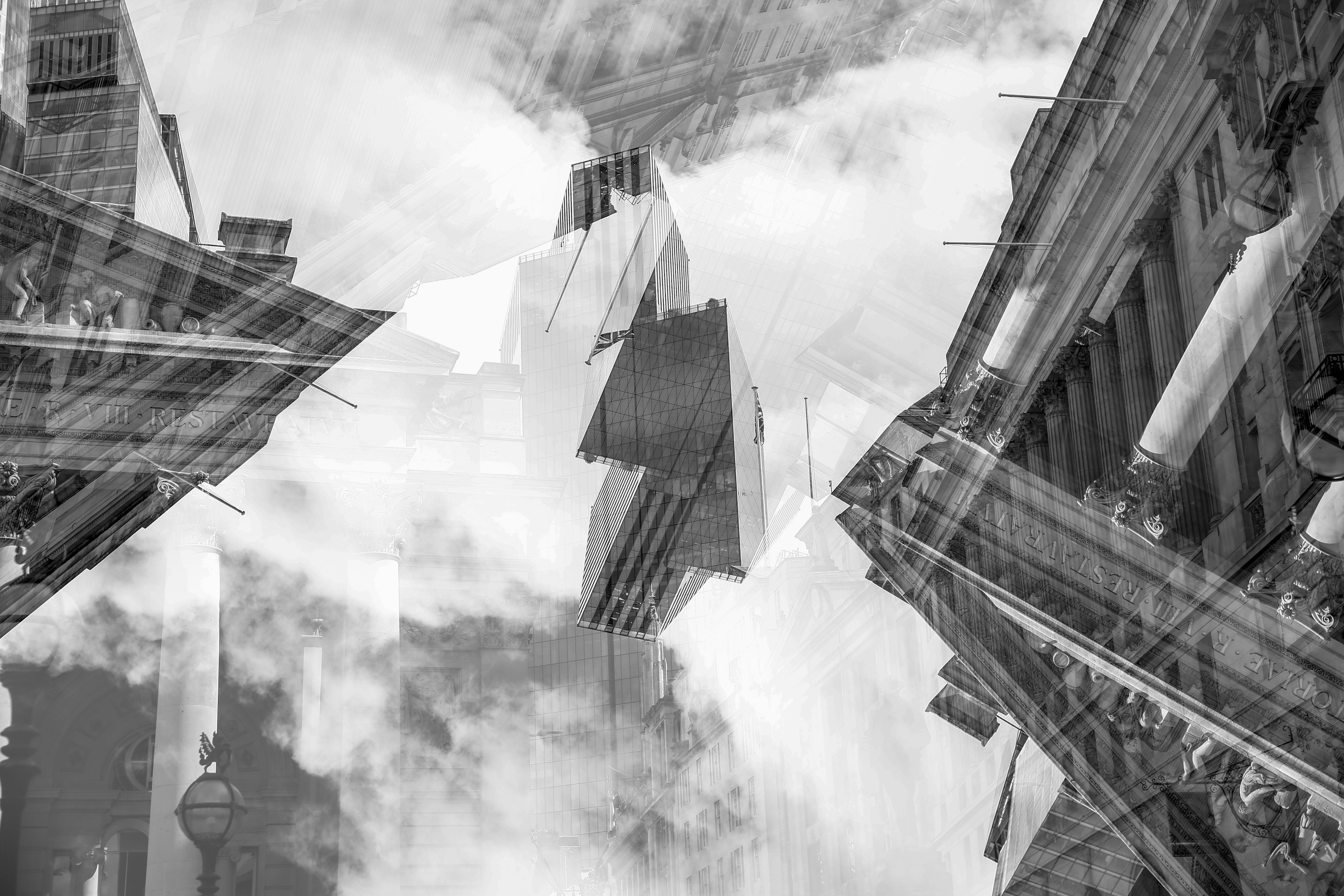 Double-exposure of urban architecture and sky creates a layered cityscape with high-contrast grayscale tones. Abstract architectural lines and clouds merge, giving a surreal street-level perspective.