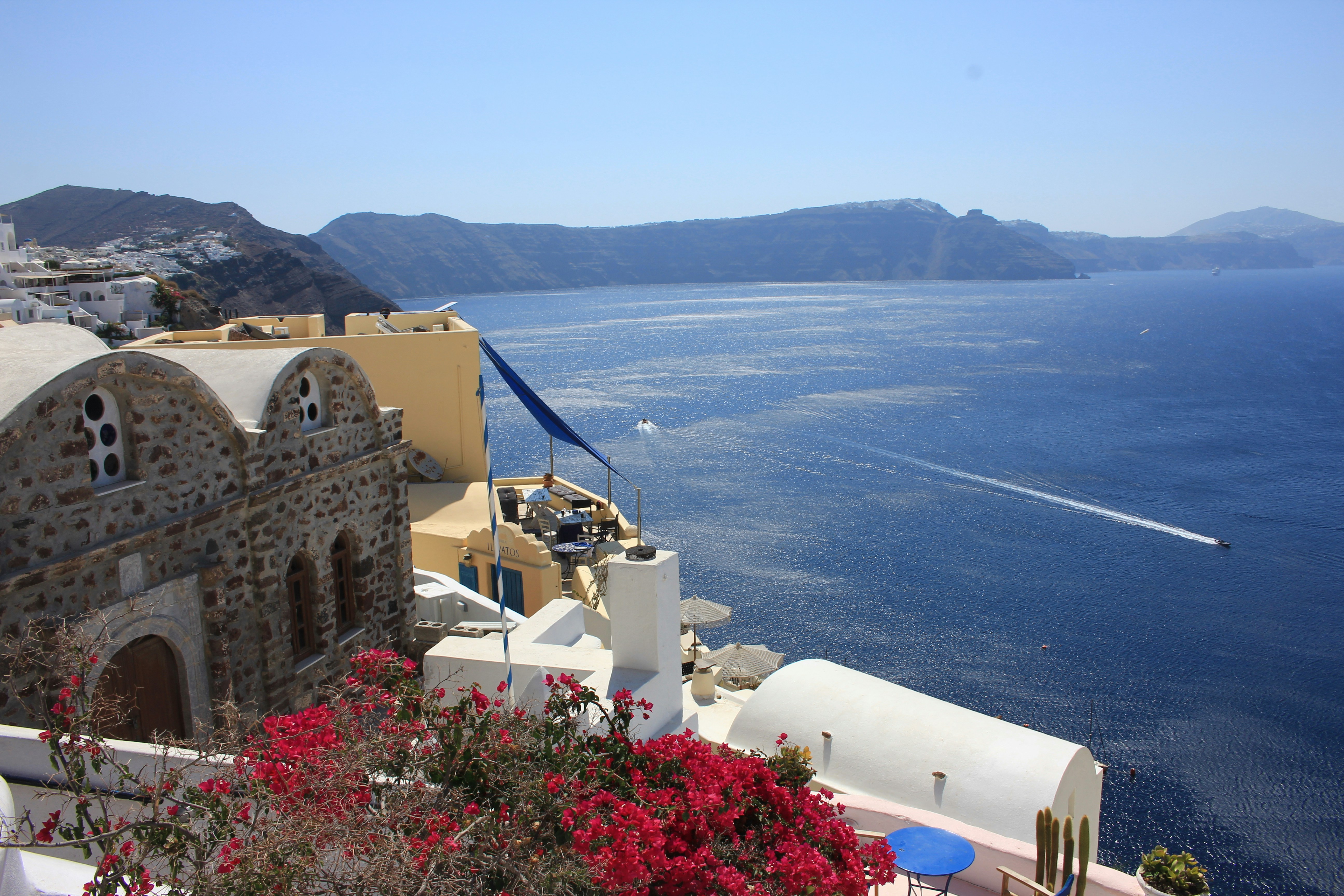Sunlit Cycladic Coast: Whitewashed Balconies Over Blue Aegean