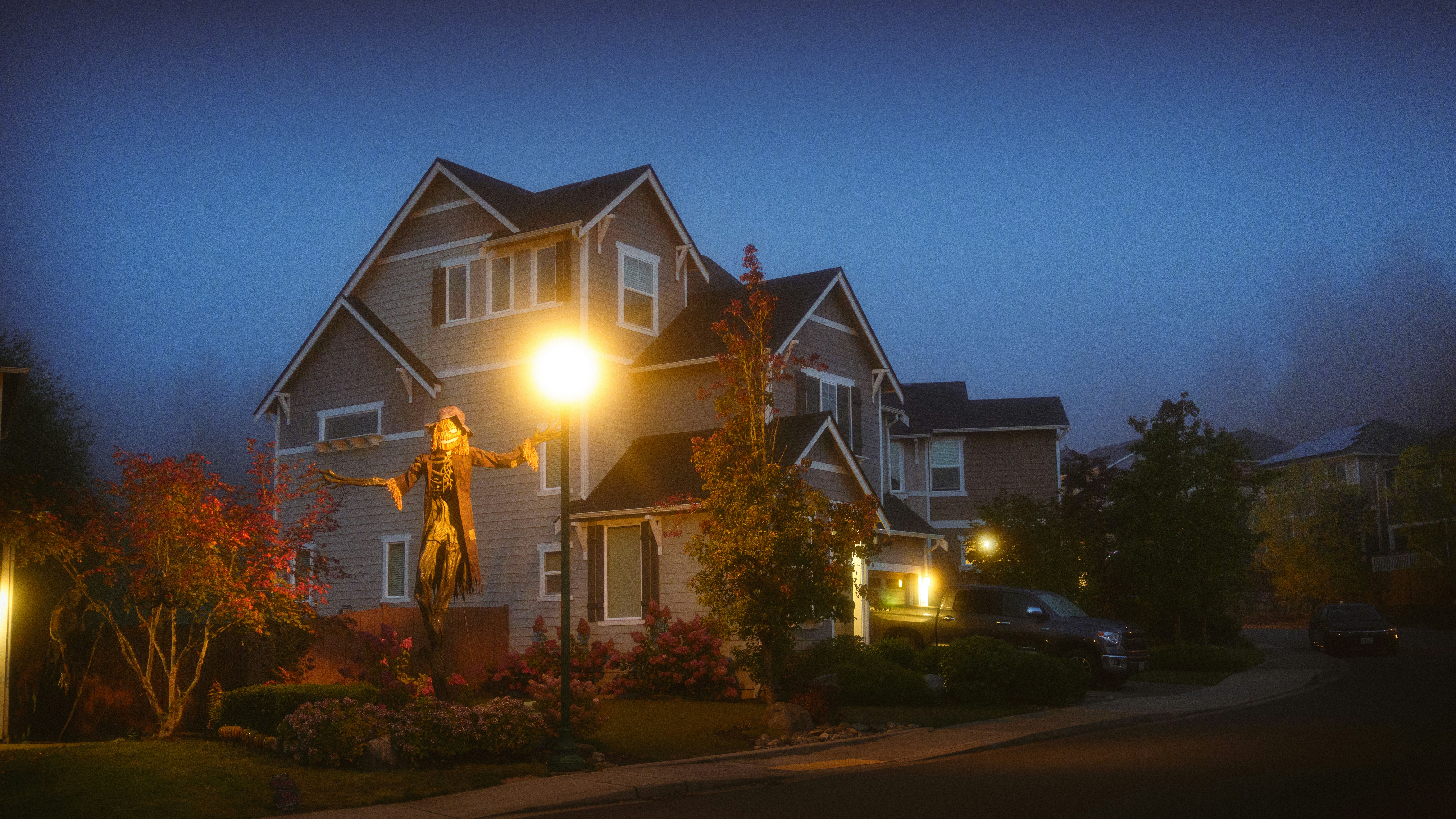 Evening Streetlit Home Emerges from Twilight