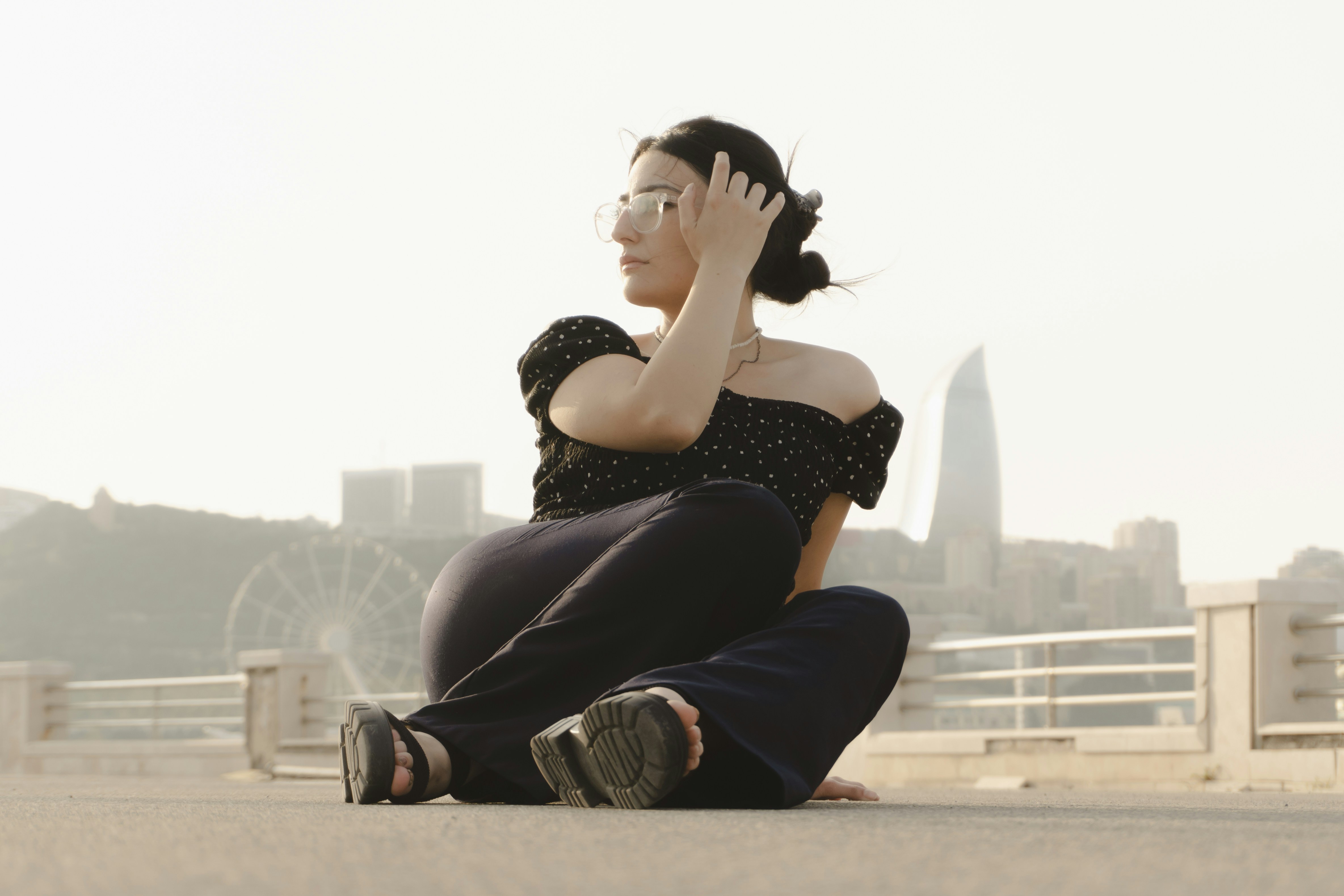 City Rooftop Quiet: A Woman in Contemplation