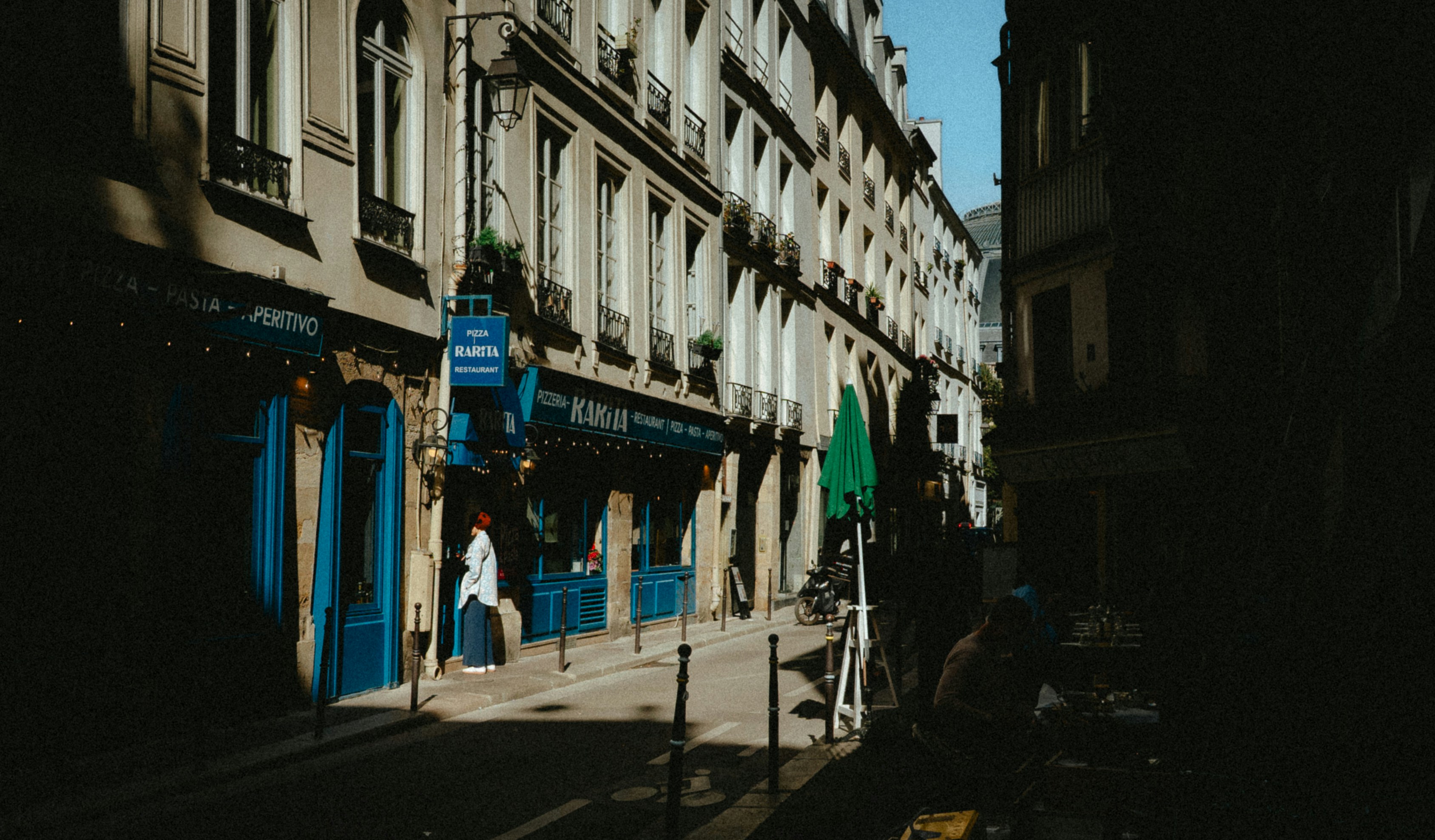 Sunlit Street Café Veil: A Quiet Corridor of City Light