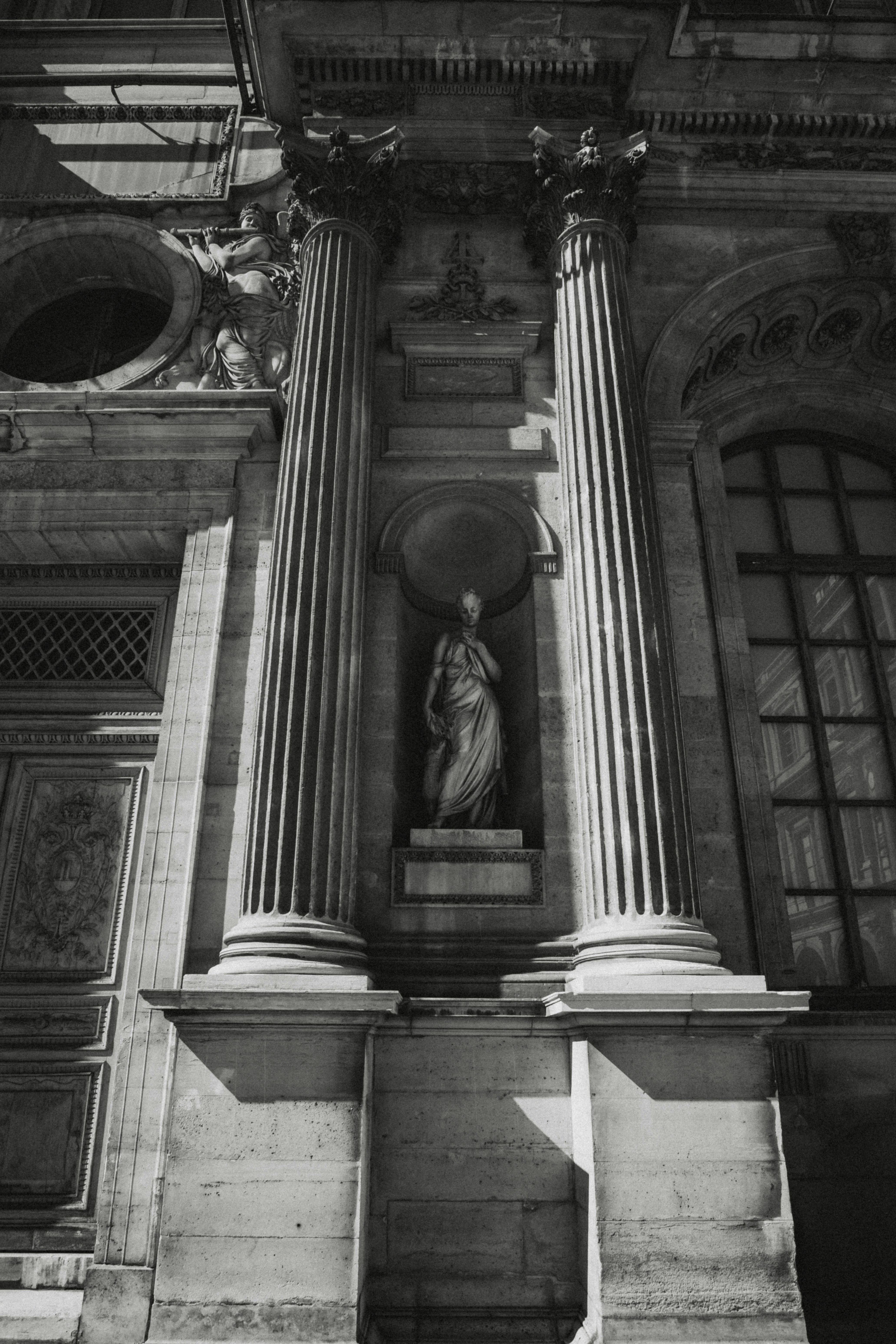 Stone Seraphim Guard: A Monumental Facade in Monochrome