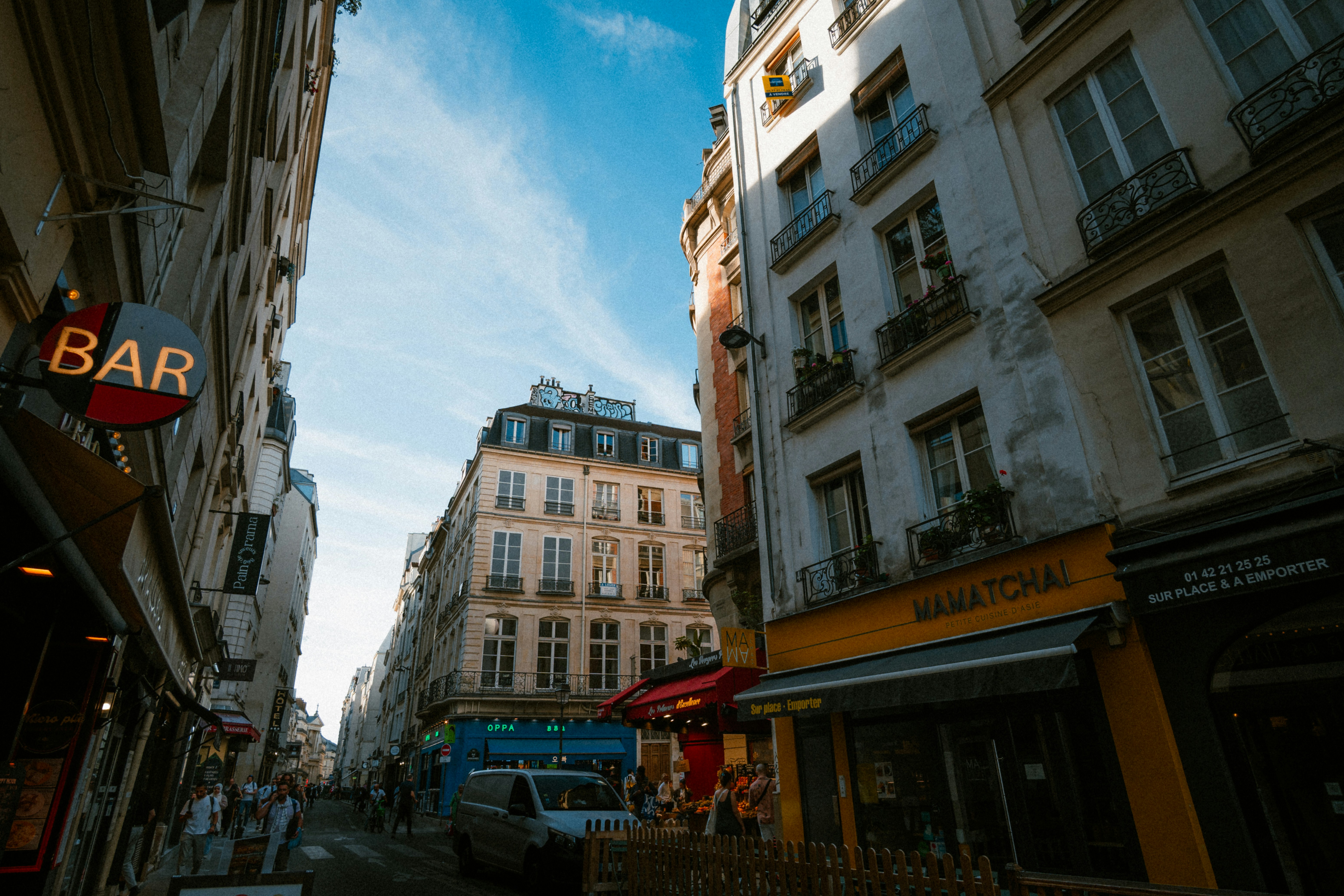 Cobbled Boulevard Under a Blue Noon, Parisian Facades Framing a Quiet Street