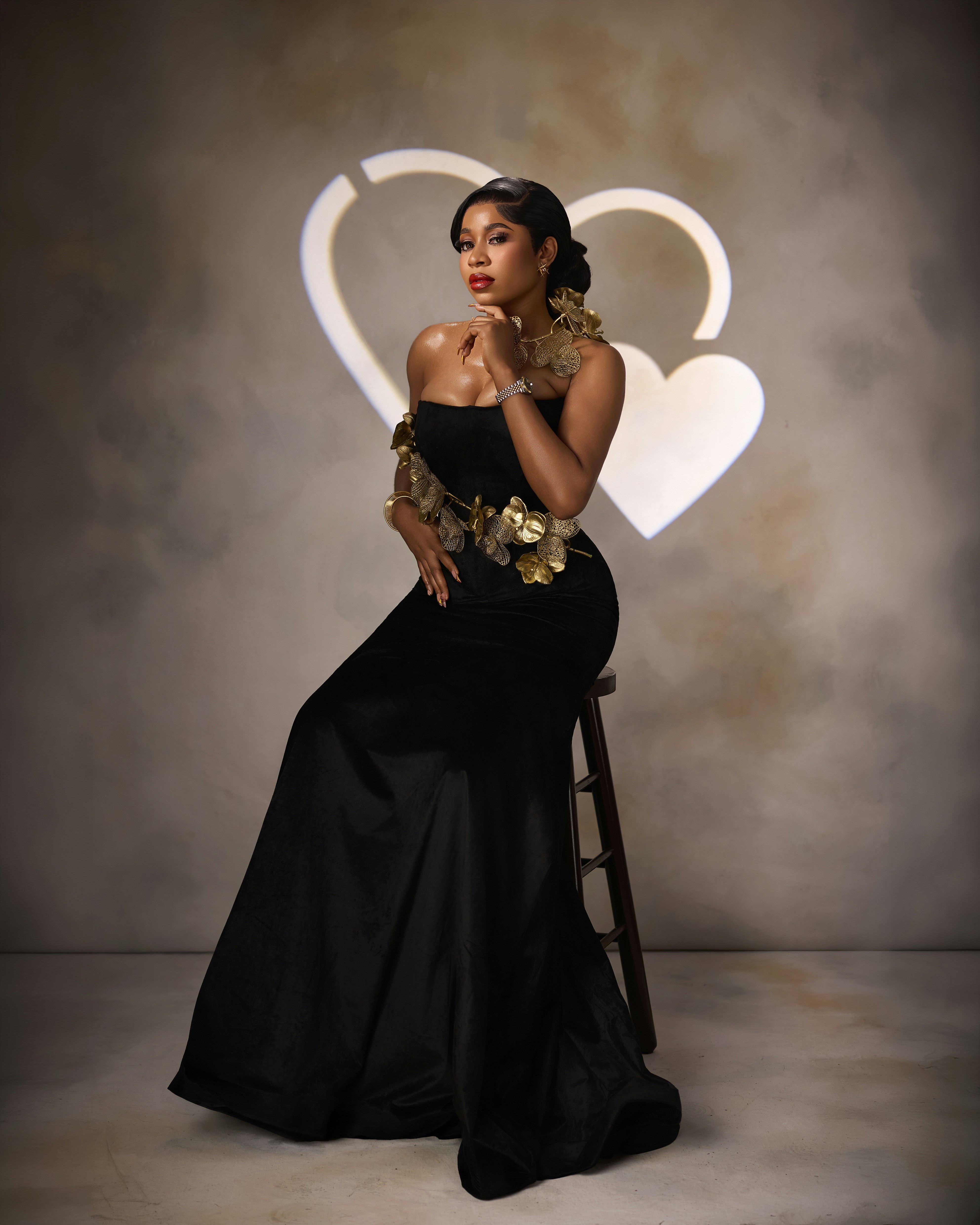 Silhouette of Elegance: A Midnight Queen in Gold and Black